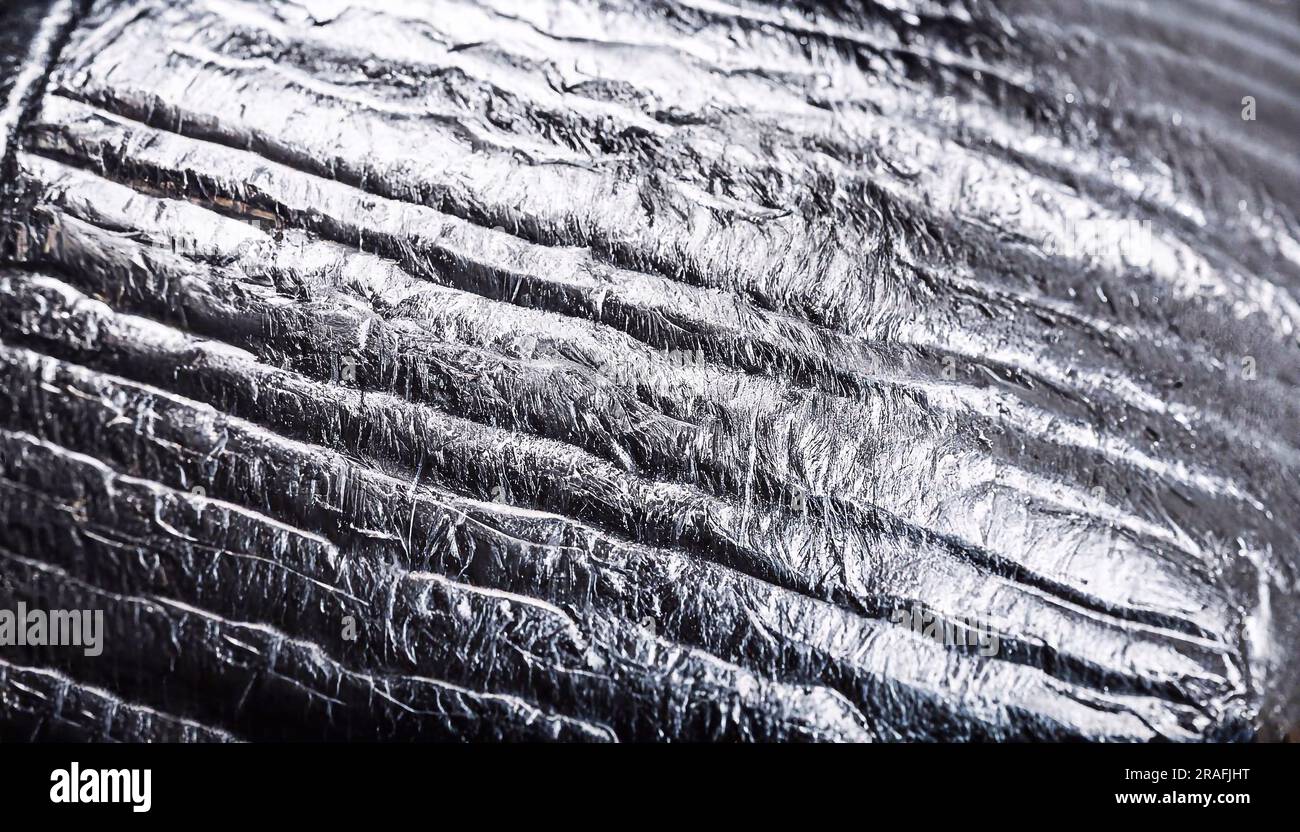 Silver texture of the material to be used as a background. High ...