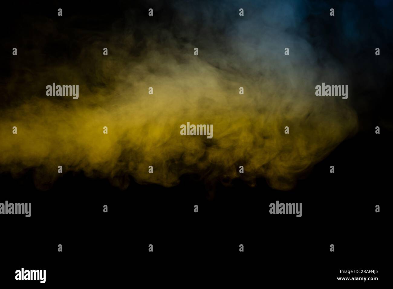 Blue and yellow steam on a black background. Copy space Stock Photo - Alamy