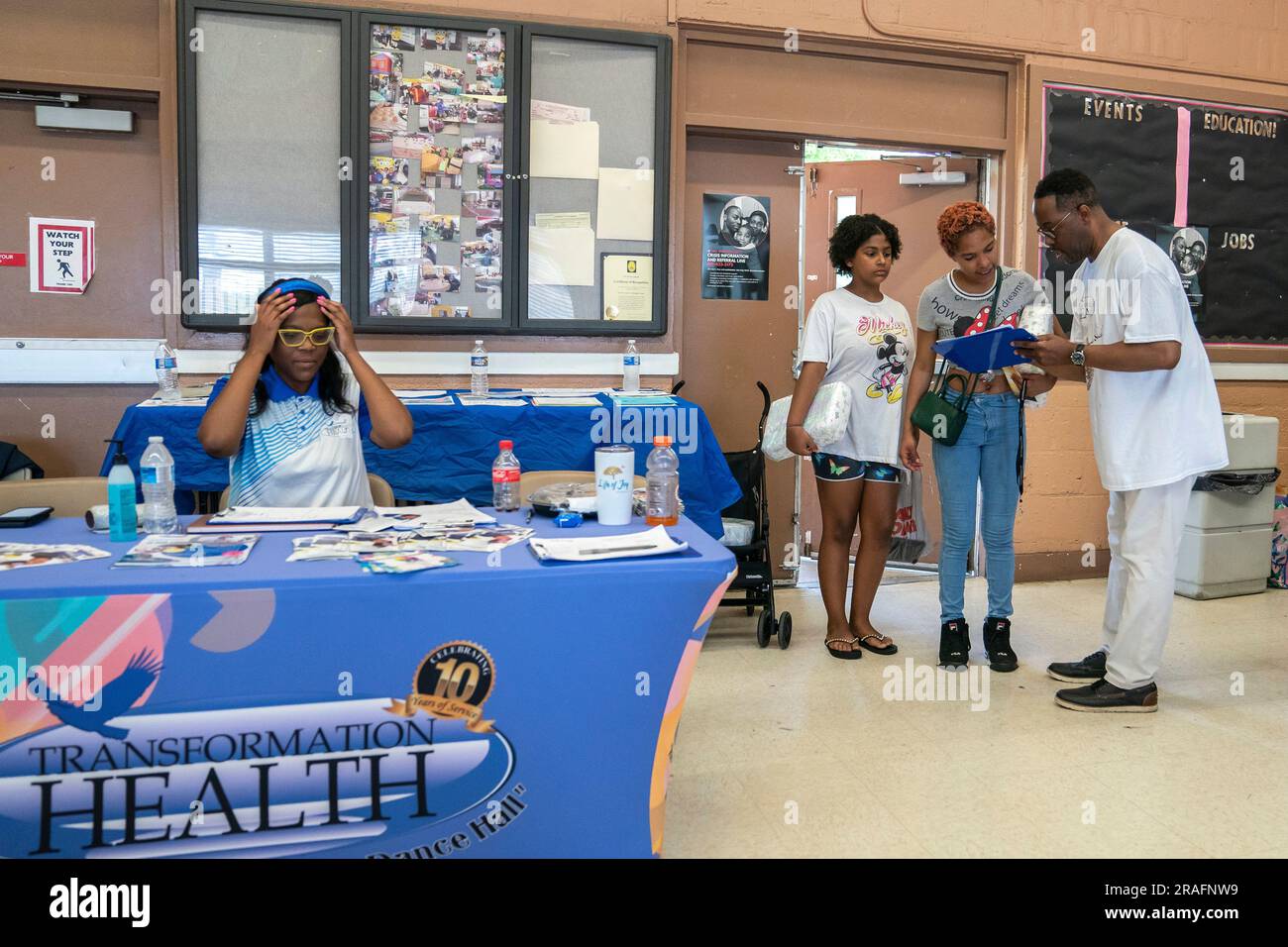 Community members visit a resource center set up to help victims the ...