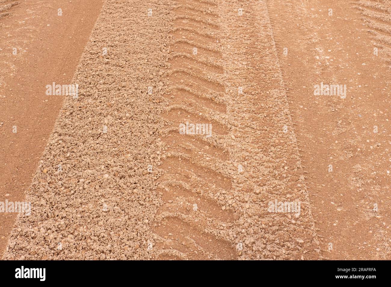 Footprint of car tire tread in a sand gravel road texture. Country road ...