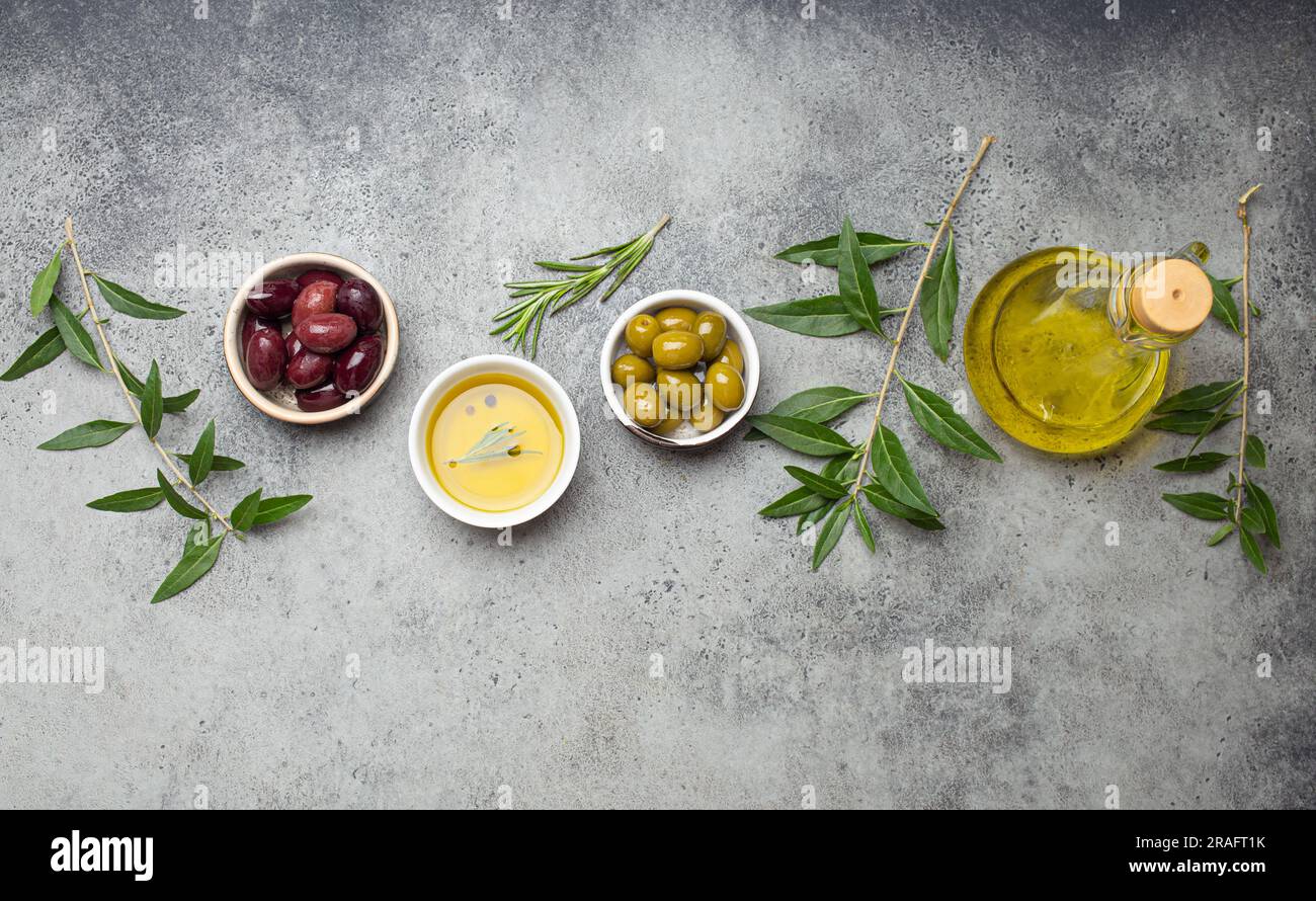 Composition with green and brown olives, extra virgin olive oil in ...