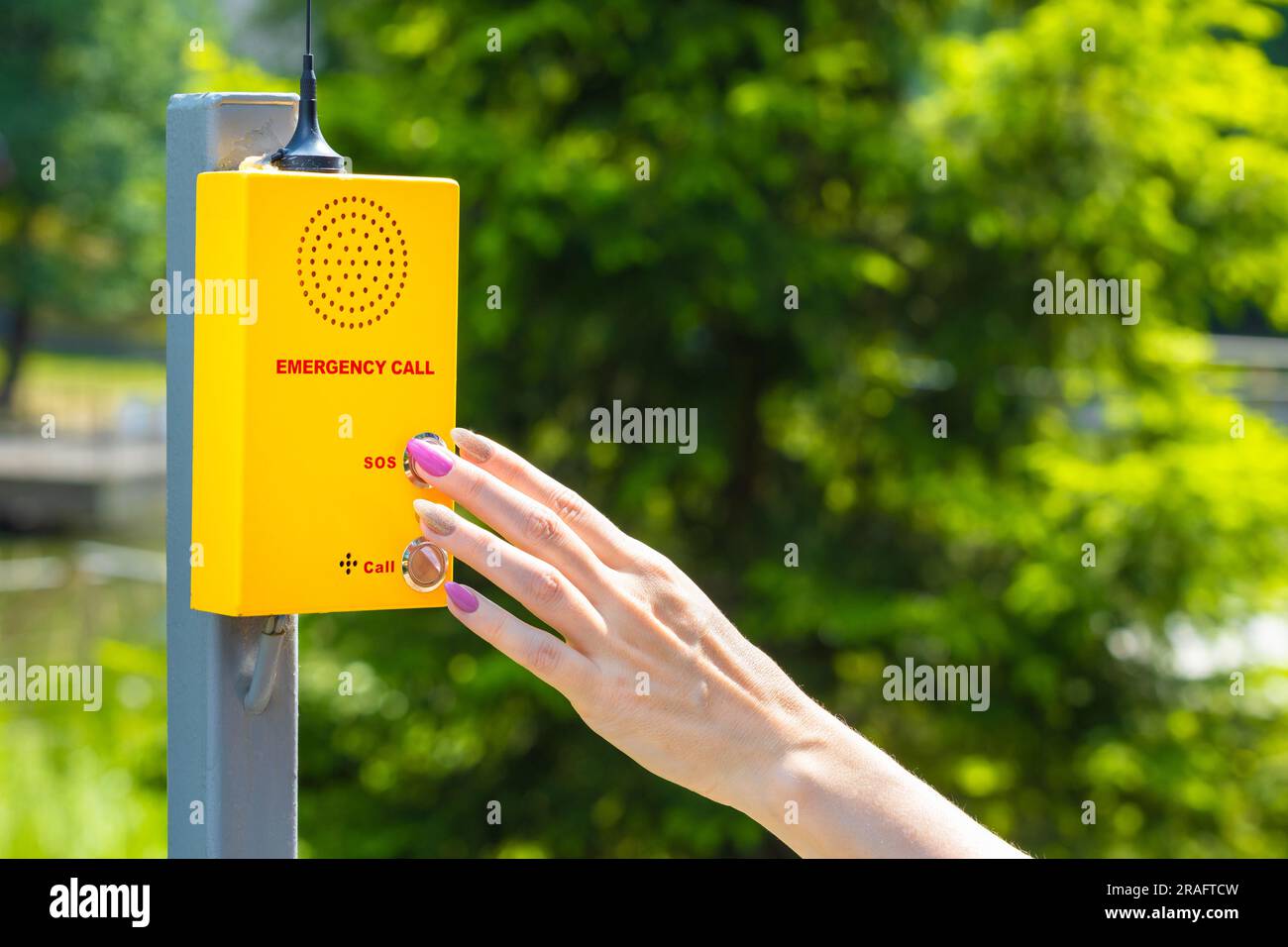 woman calling rescuers by walkie-talkie in the park. park help signal ...