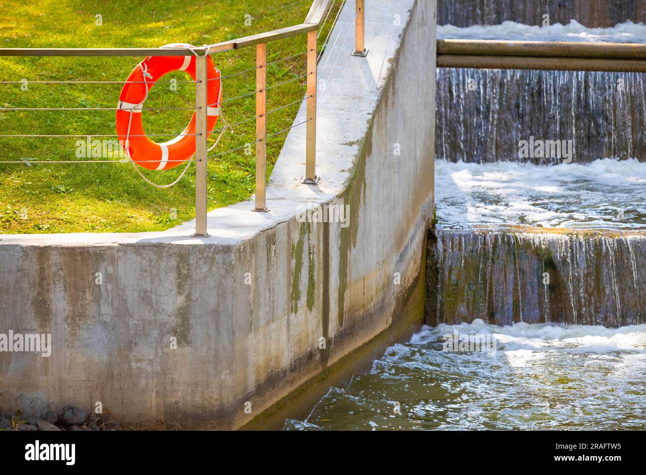 red lifebuoy on the pier without people. marine lifeline. lifeline on a ...