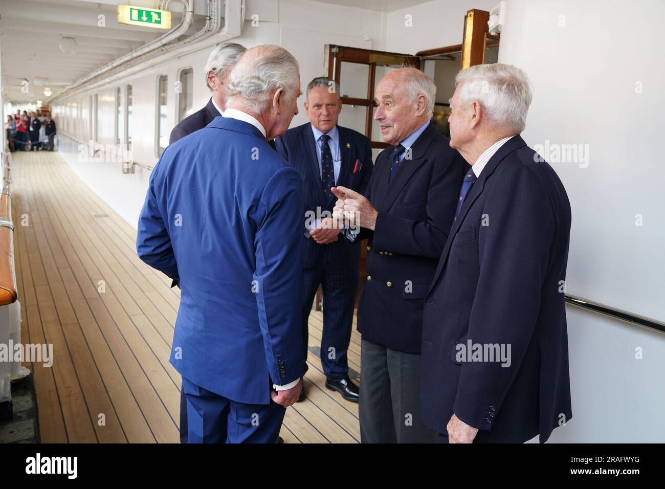 King Charles III (left) speaks with Captain Sir Nicholas Wright, during ...