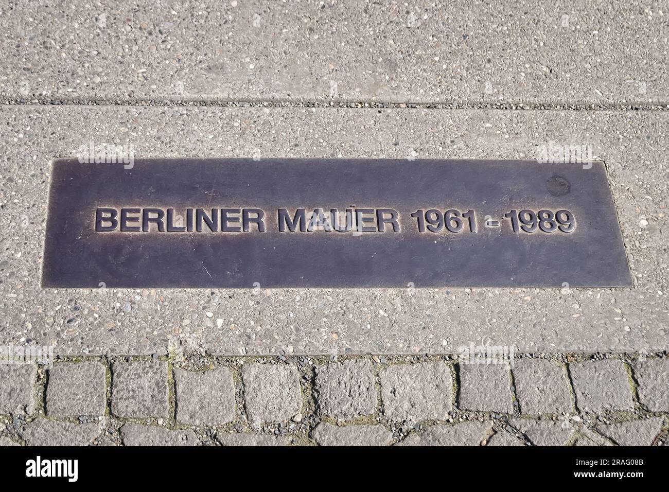 A sign with an inscription on the site where the Berlin Wall was Stock ...