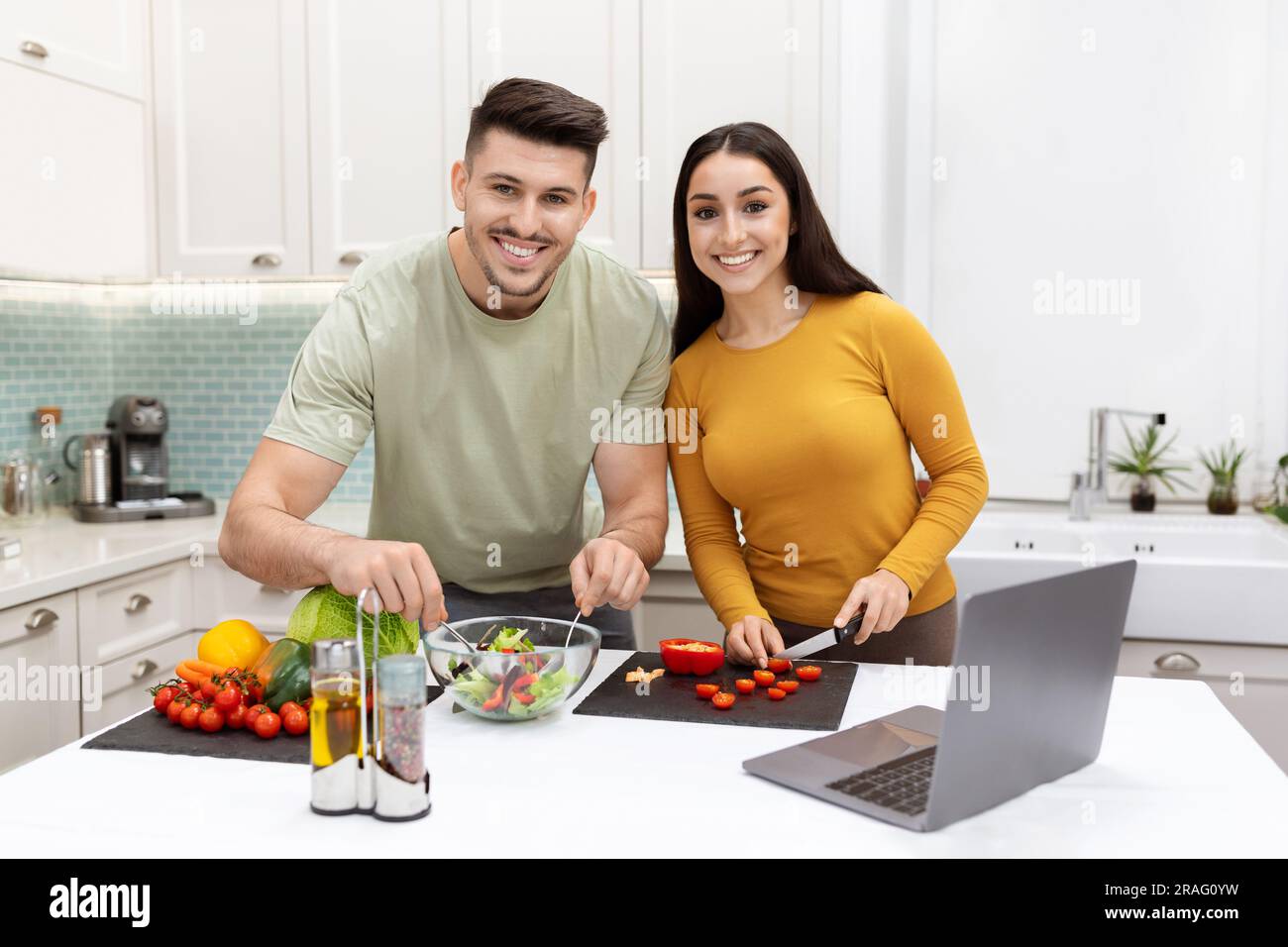 Happy attractive young couple preparing hi-res stock photography and ...