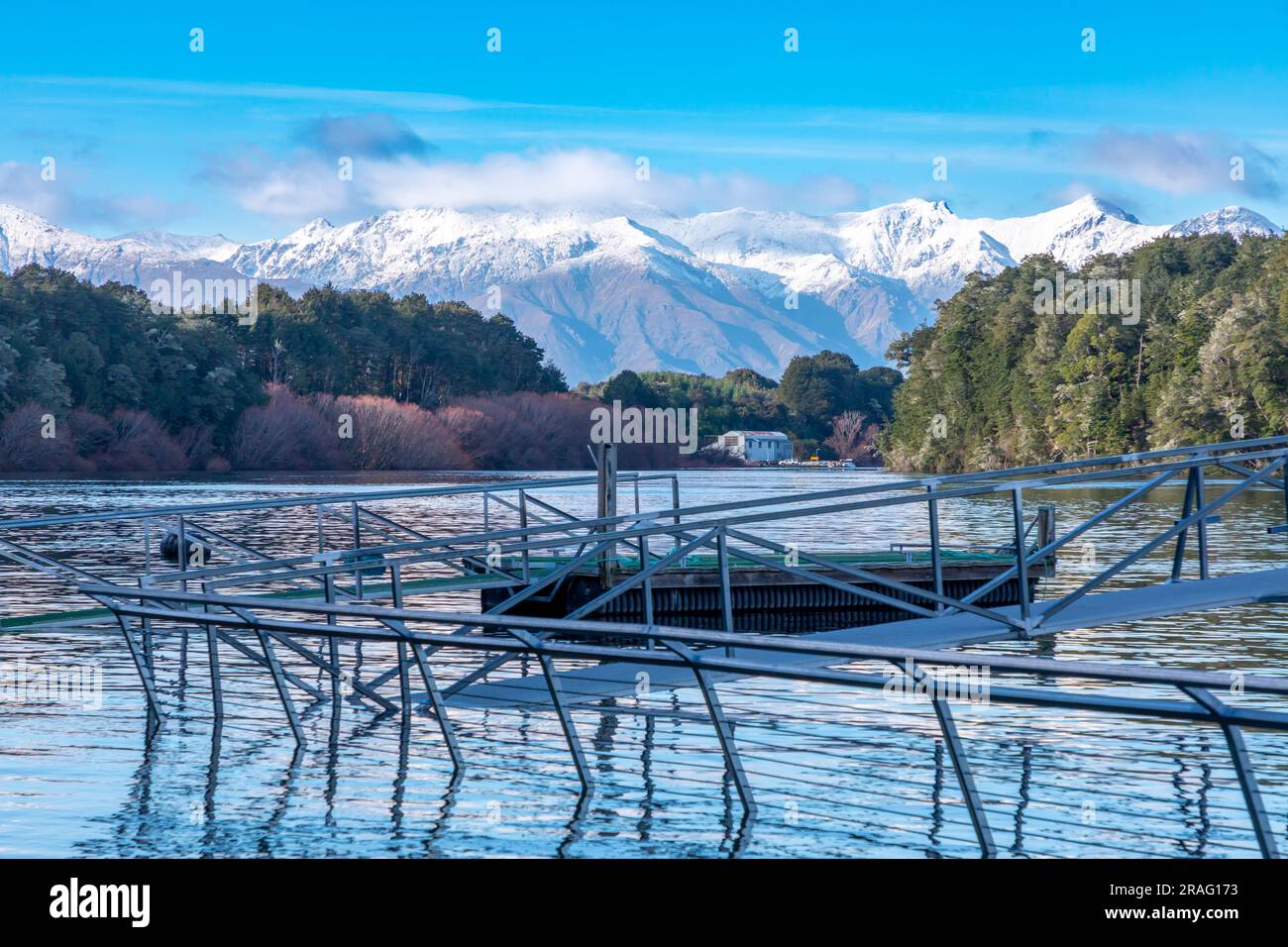 Photograph of snow-capped mountains and flood waters in the Waiau River ...