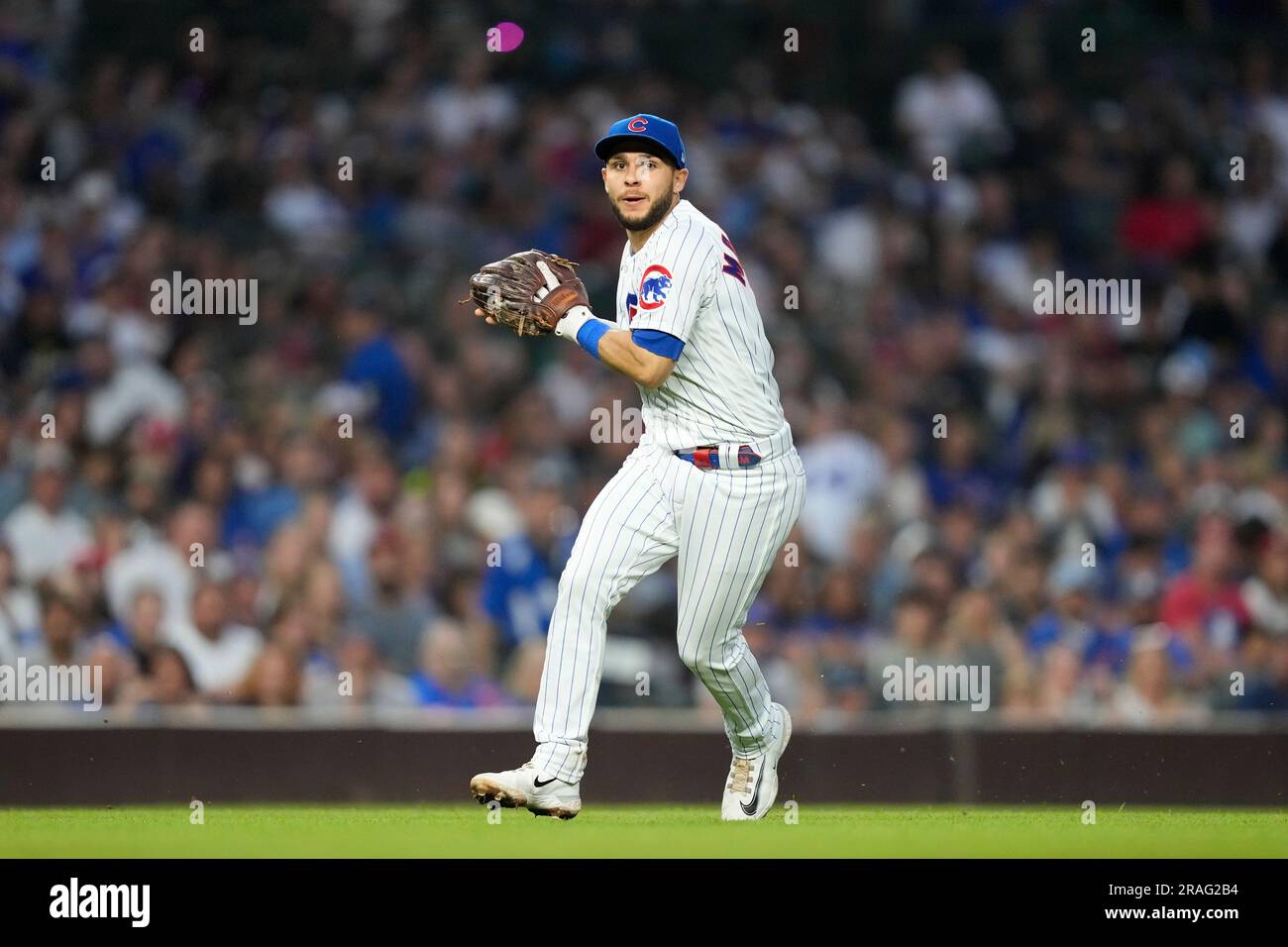 Chicago Cubs third baseman Nick Madrigal eyes a throw to first during a ...