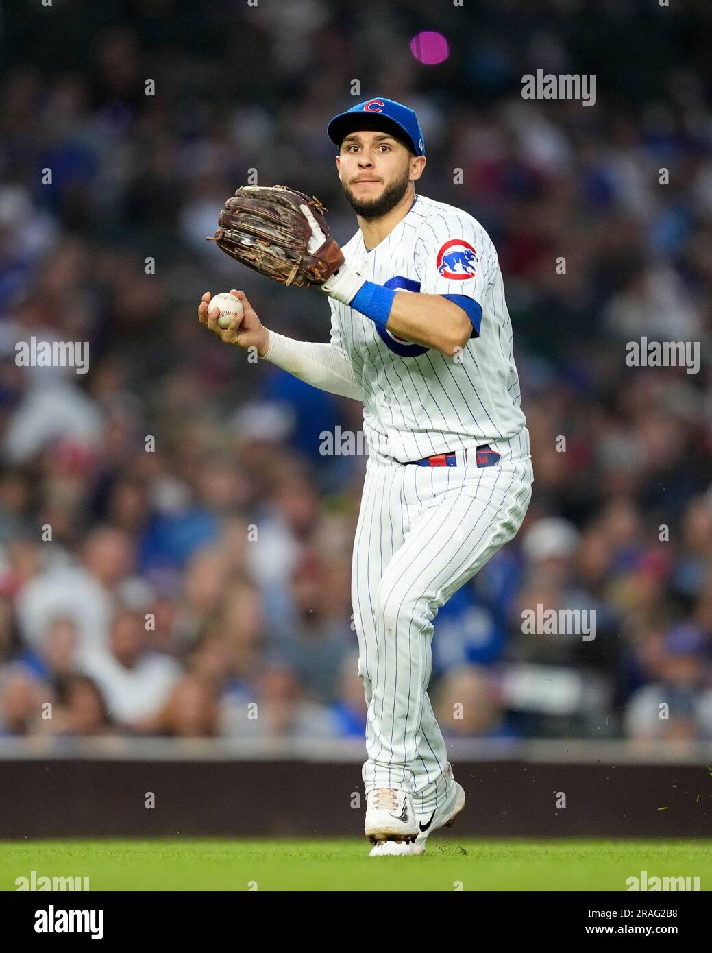 Chicago Cubs third baseman Nick Madrigal eyes a throw to first during a ...