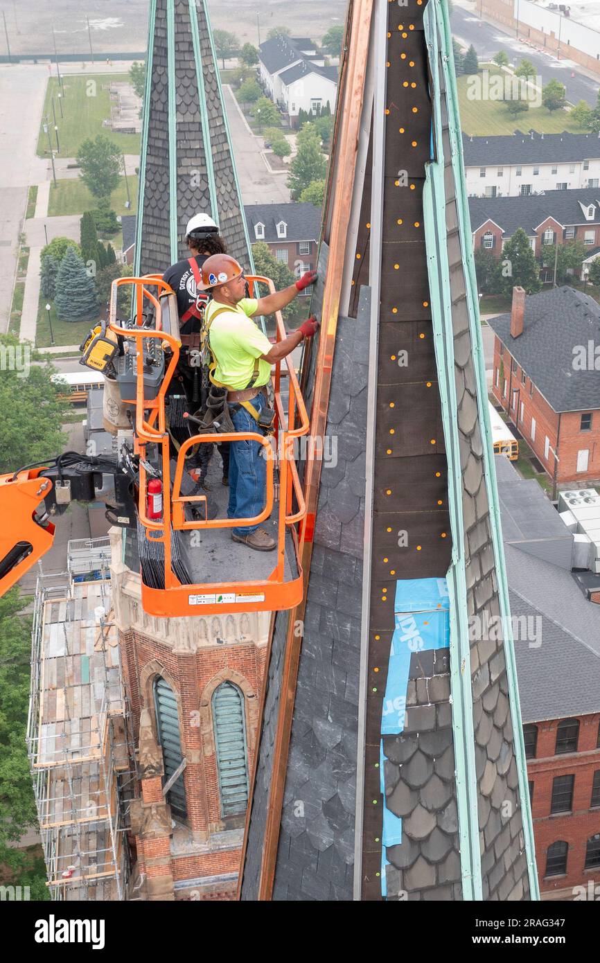 Detroit, Michigan - Workers repair the towers of the Basilica of Ste ...