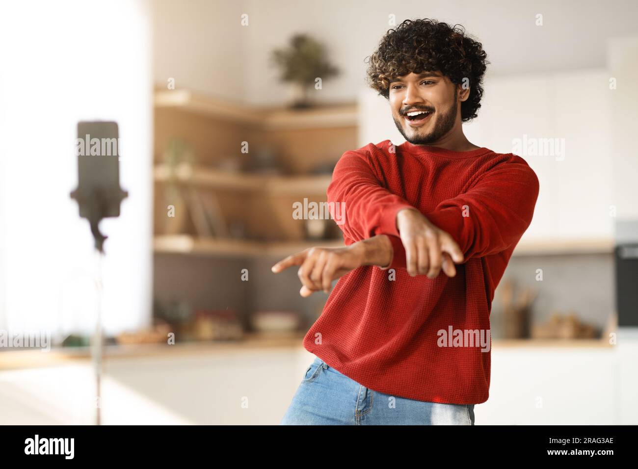 Handsome Indian Male Dancing At Smartphone Camera While Recording Video ...