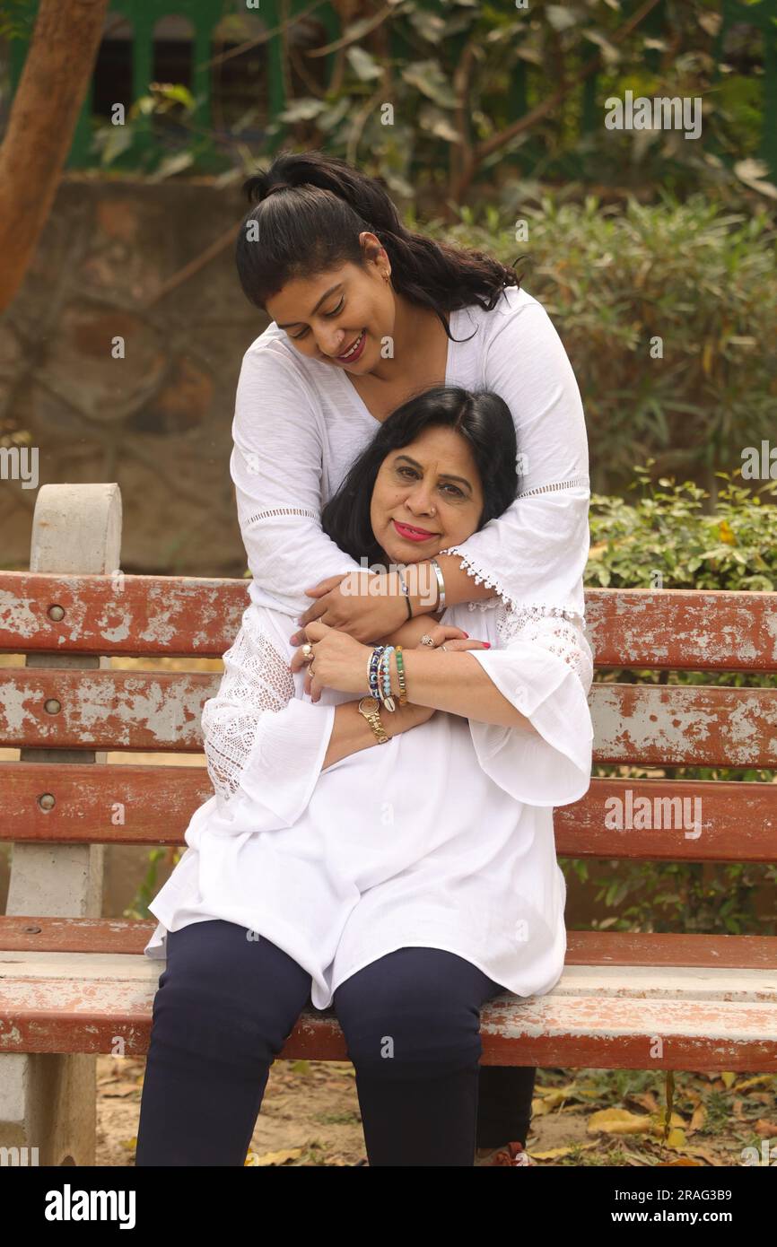 Happy Indian Mother And Daughter In White Dress Having Beautiful