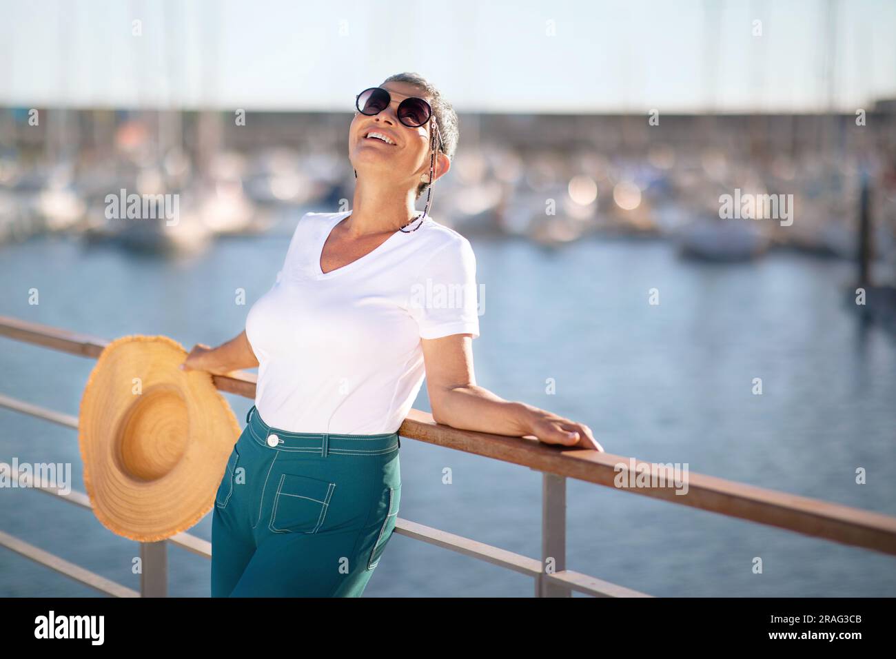 Happy Senior Lady Posing At Sea Promenade Near Marina Dock Stock Photo ...