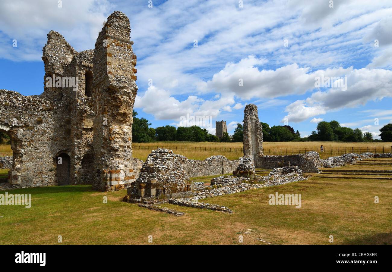 Part of Castle Acre priory with Castle Acre village church tower in ...