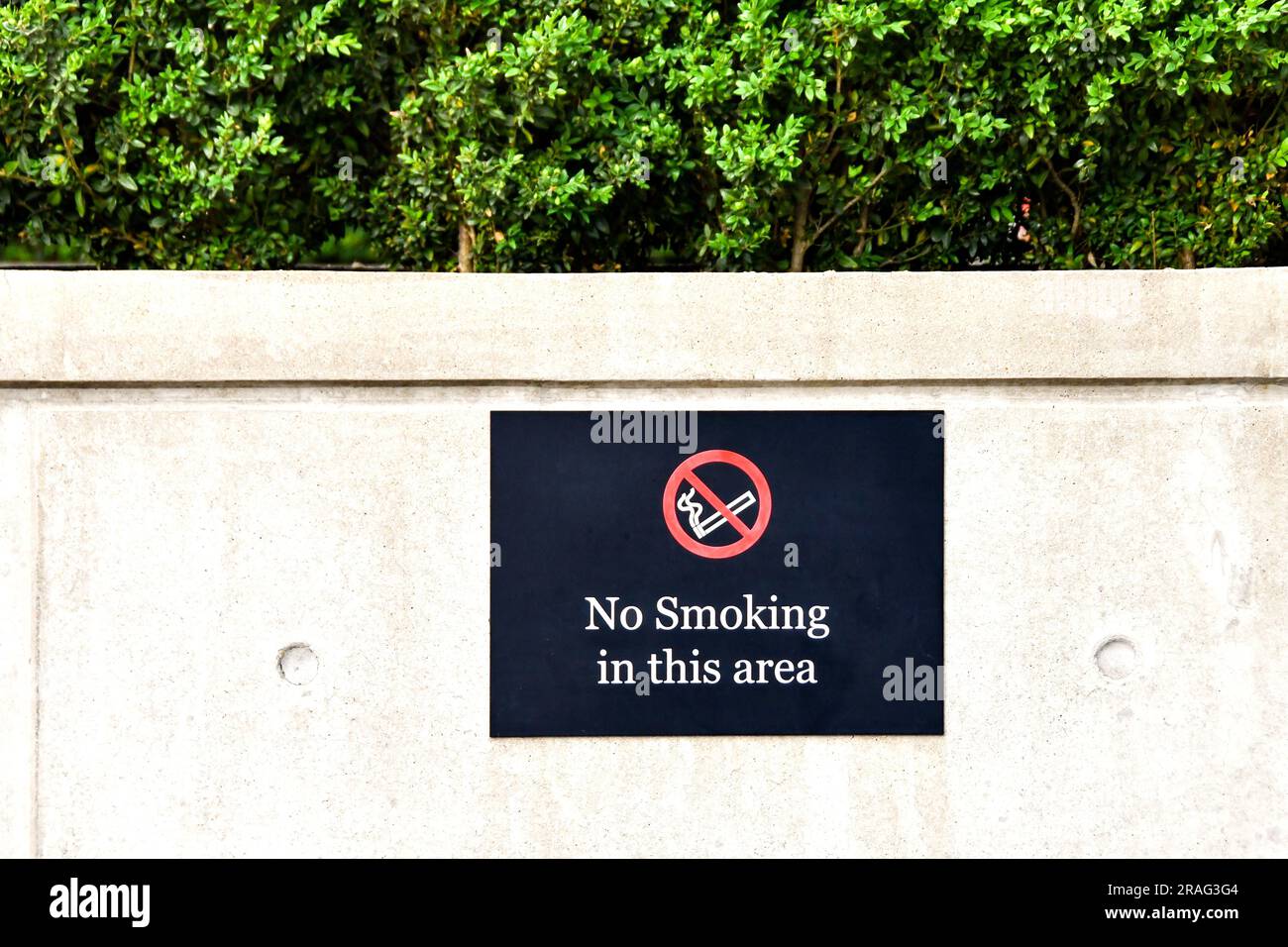 No smoking sign on the wall of a private road. No people Stock Photo ...