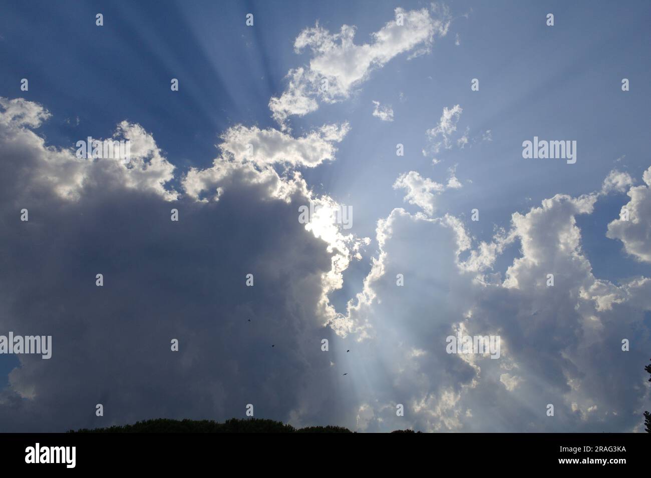Nice cloudy sky, sun rising after it has rained Stock Photo - Alamy