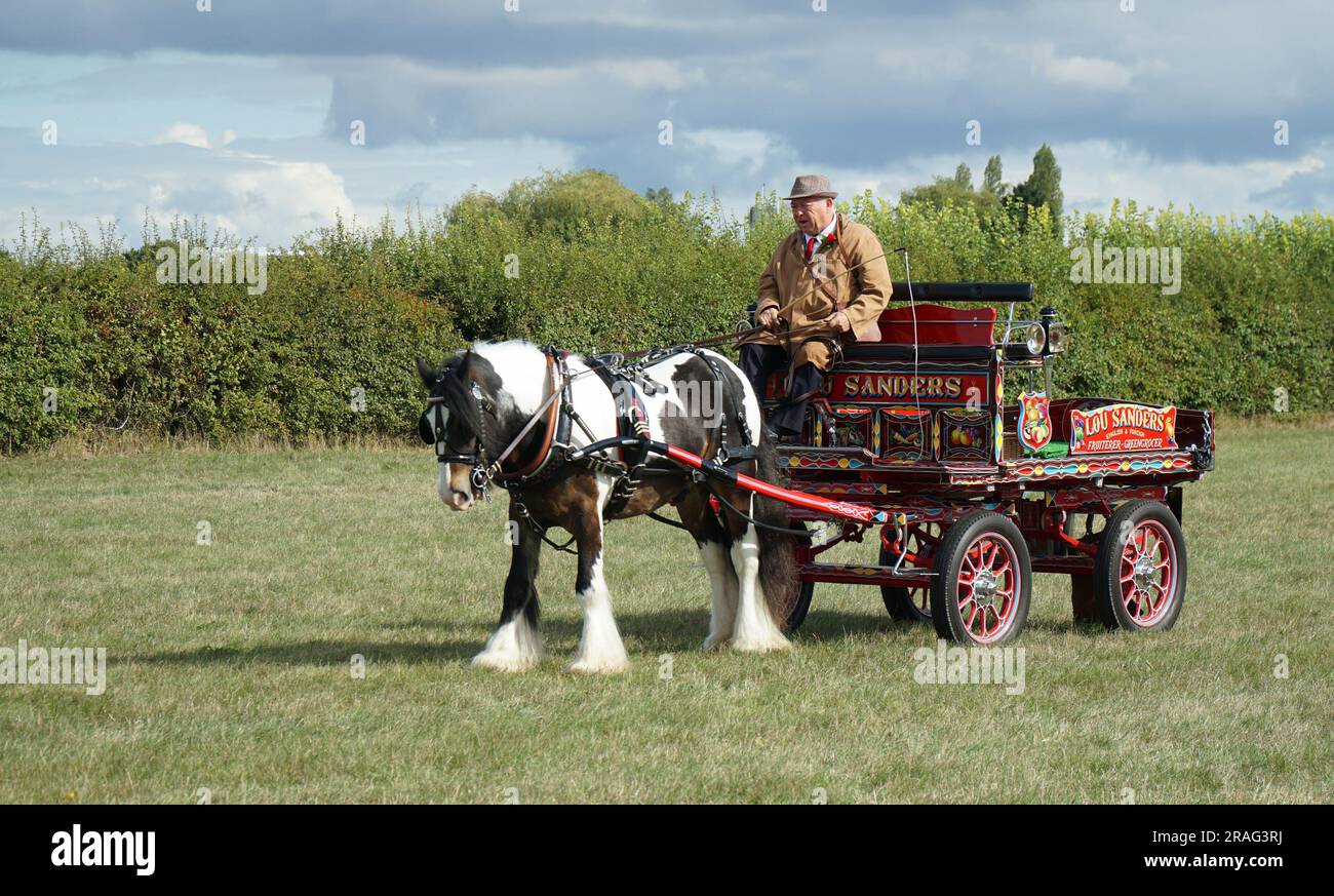 Vintage Brightly painted Heavy Horse drawn delivery wagon Stock Photo ...