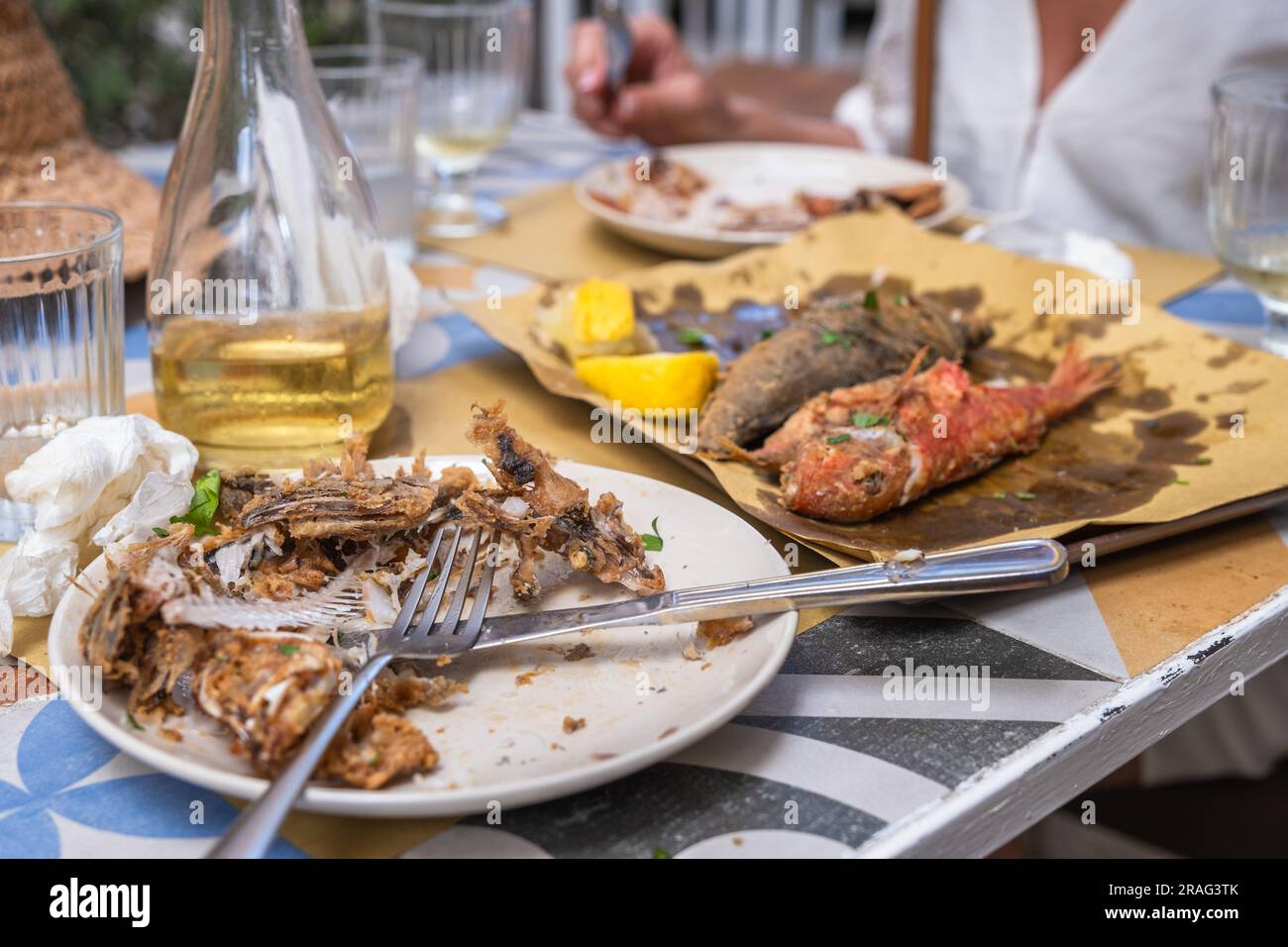 Fish bones are left after finishing the meal at the restaurant Stock ...