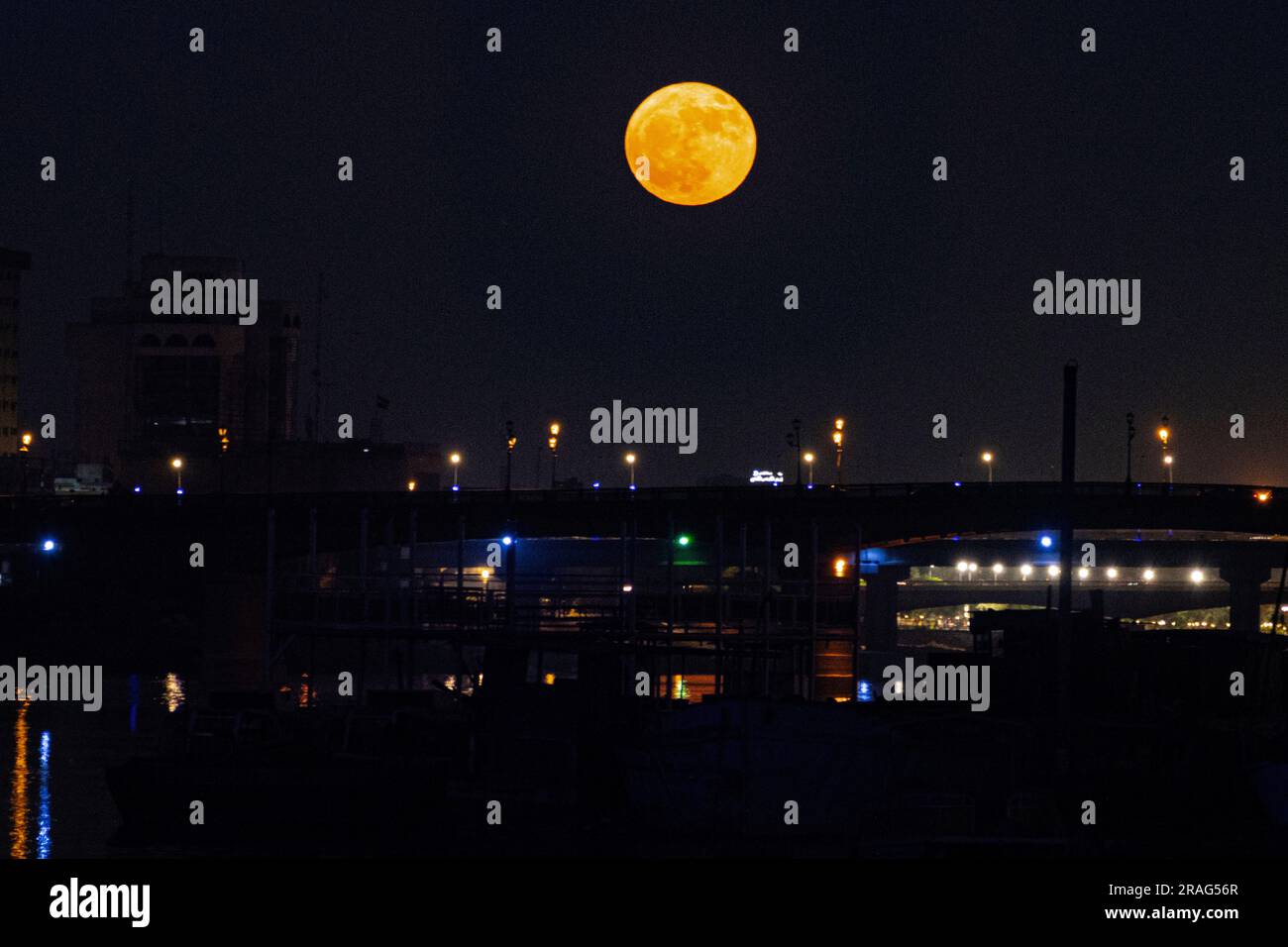 The moon shines above Baghdad, Iraq, Monday, July 3, 2023. (AP Photo ...