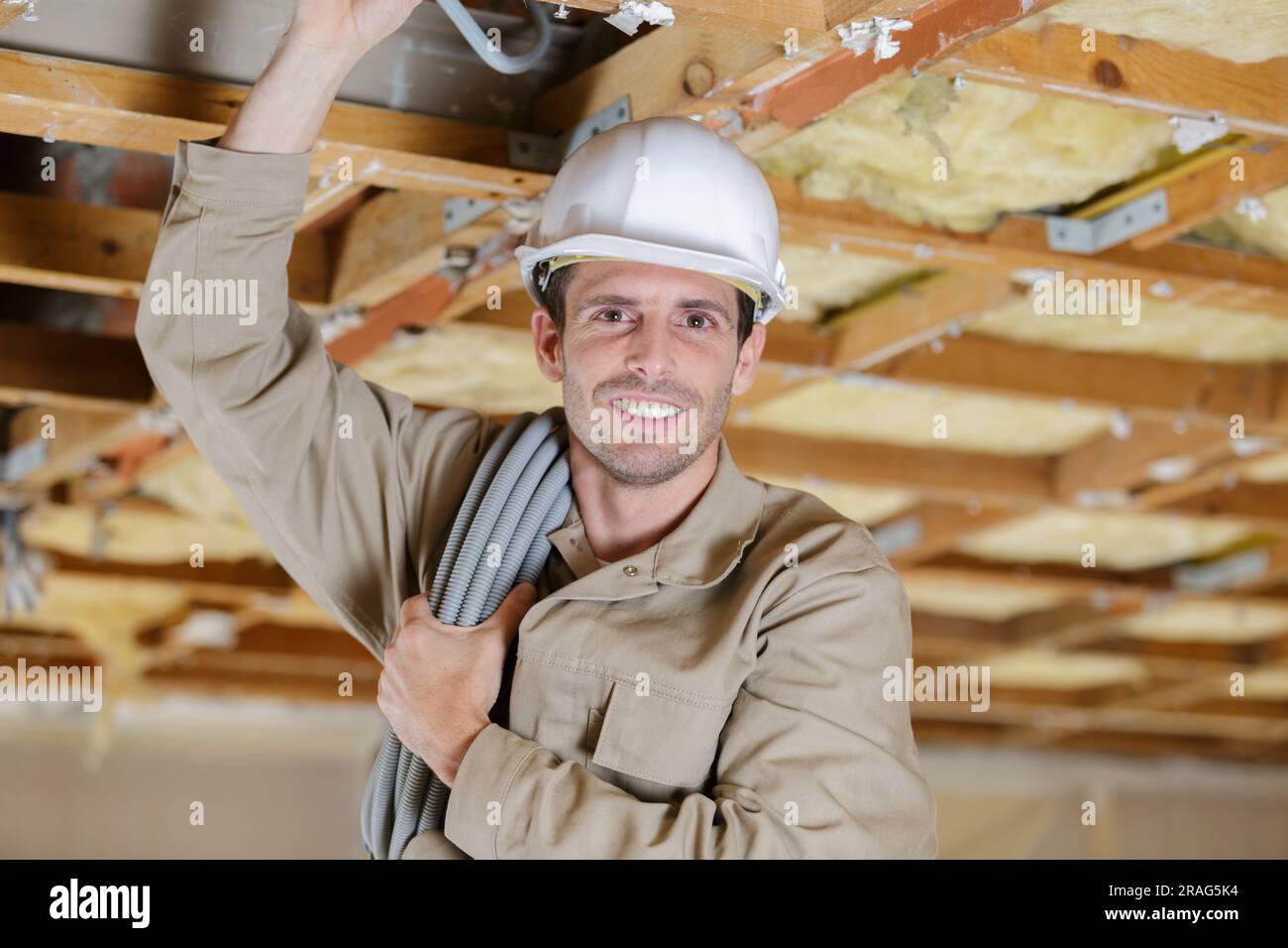 worker during finishing works of the ceiling Stock Photo - Alamy