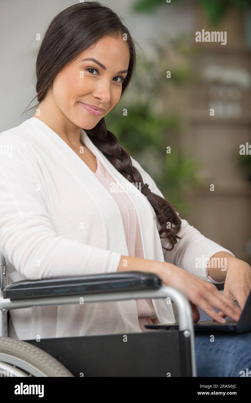 happy young woman in wheelchair Stock Photo - Alamy