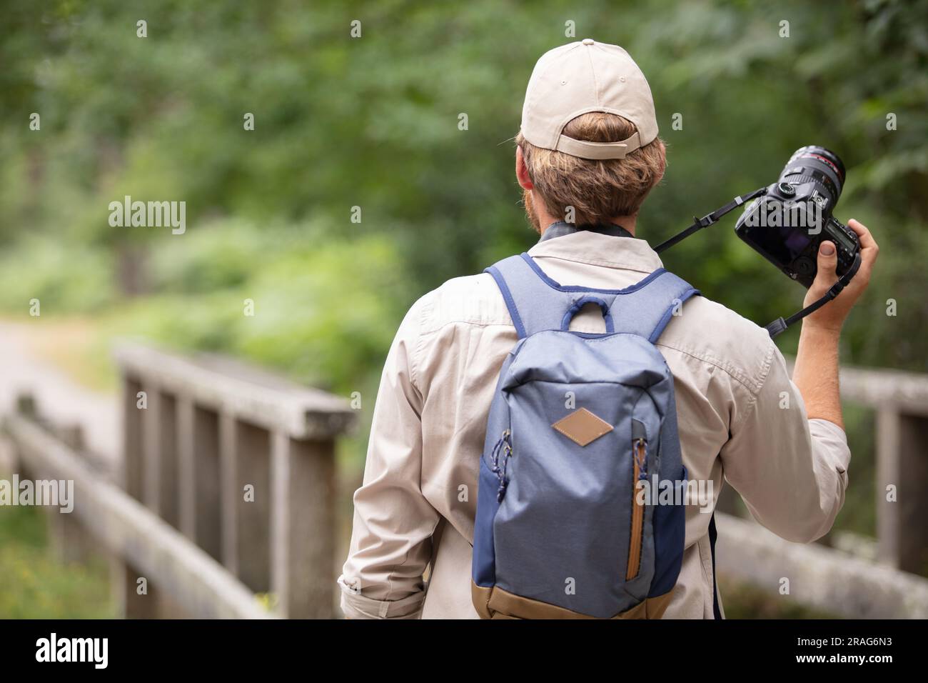 horizontal backview portrait of landscape photographer Stock Photo - Alamy
