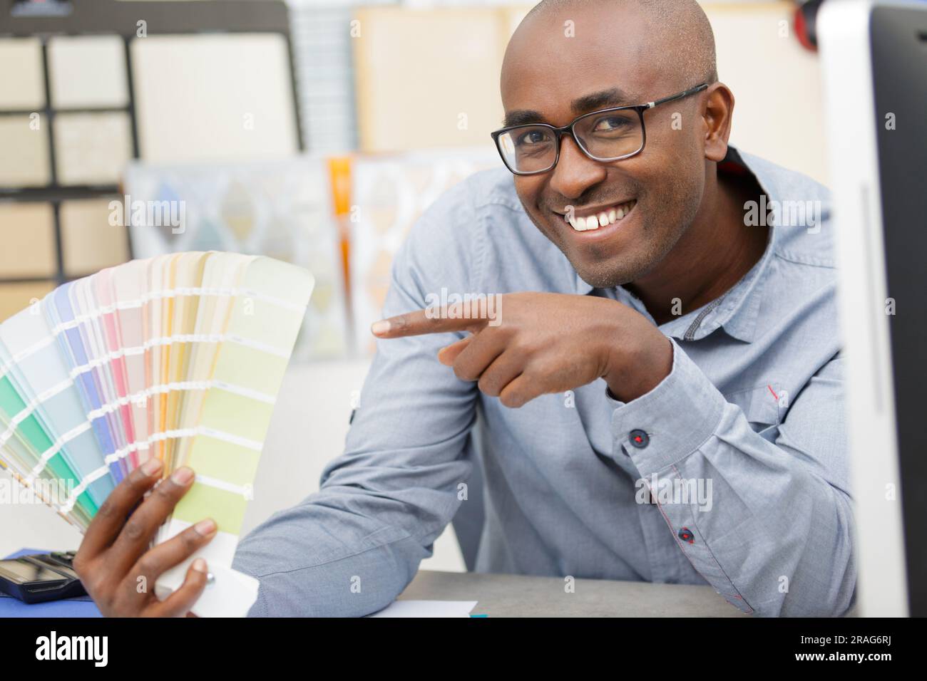 designer showing colours swatches at camera Stock Photo - Alamy