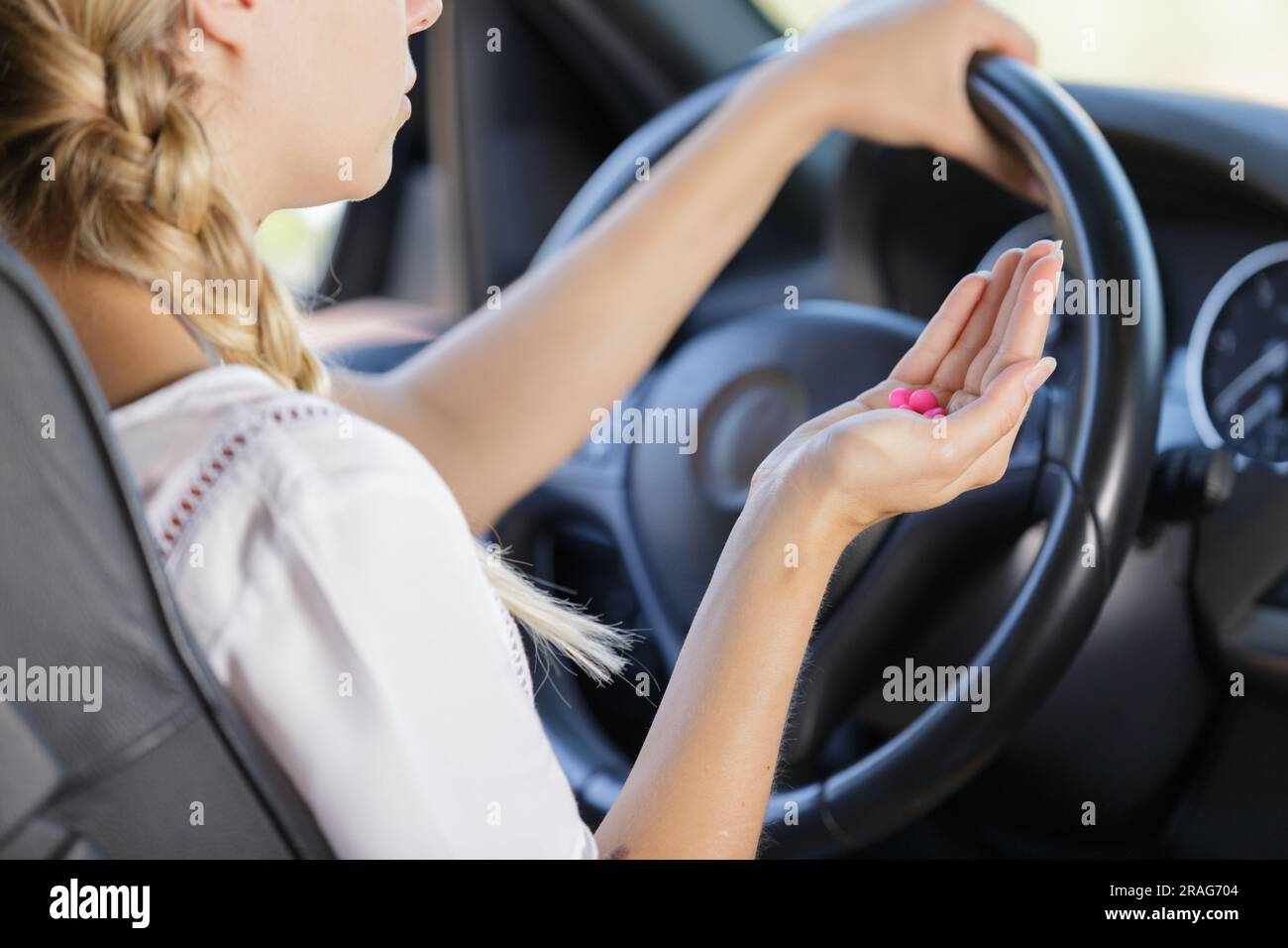 woman holding tablets while driving Stock Photo - Alamy