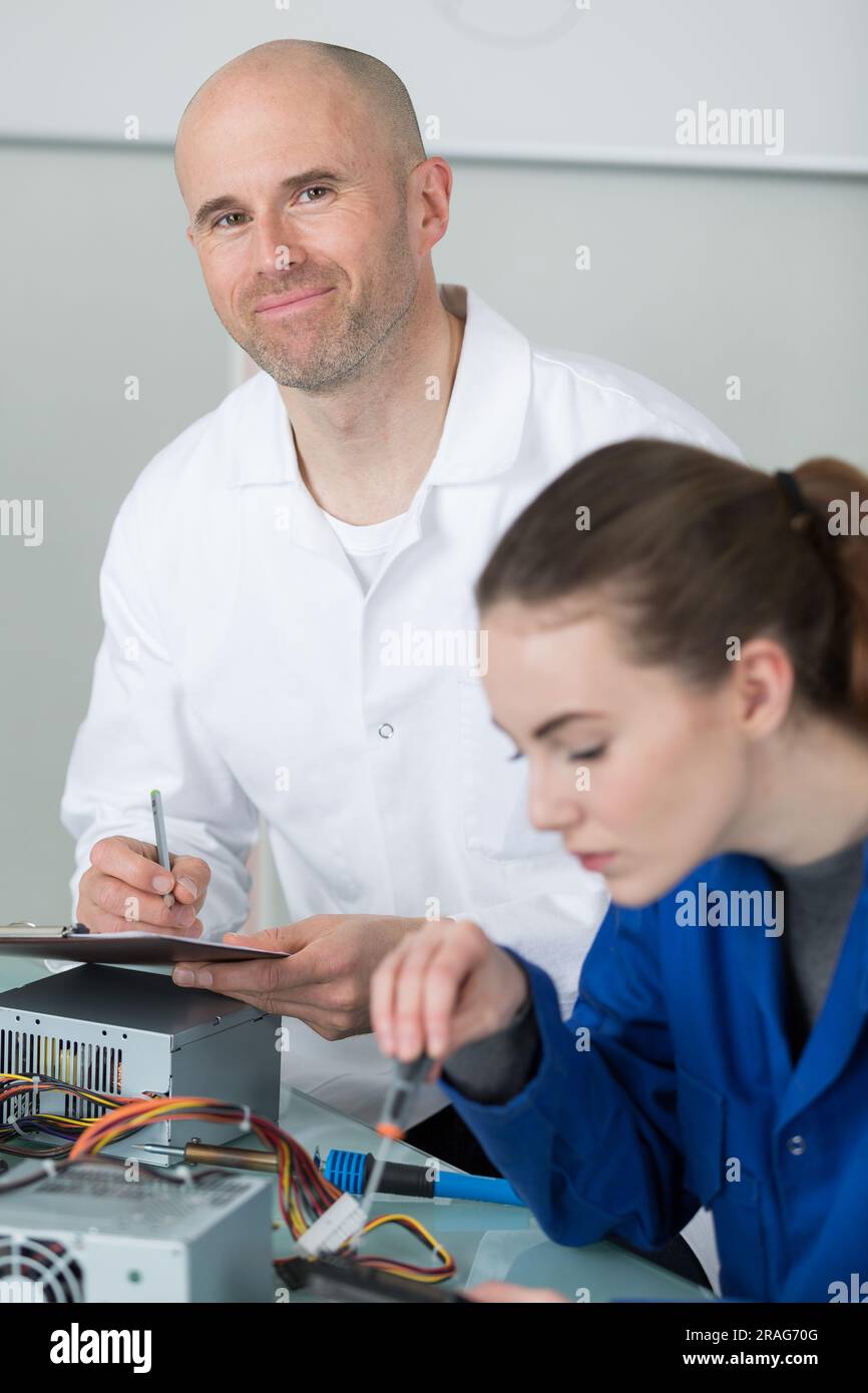 female electrician with her teacher in class Stock Photo - Alamy