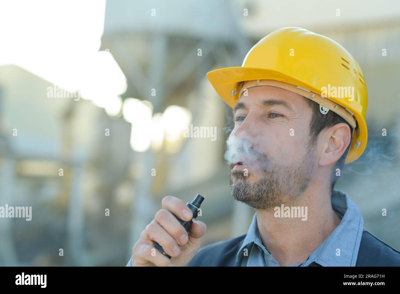 Construction worker smokes cigarette hi-res stock photography and ...