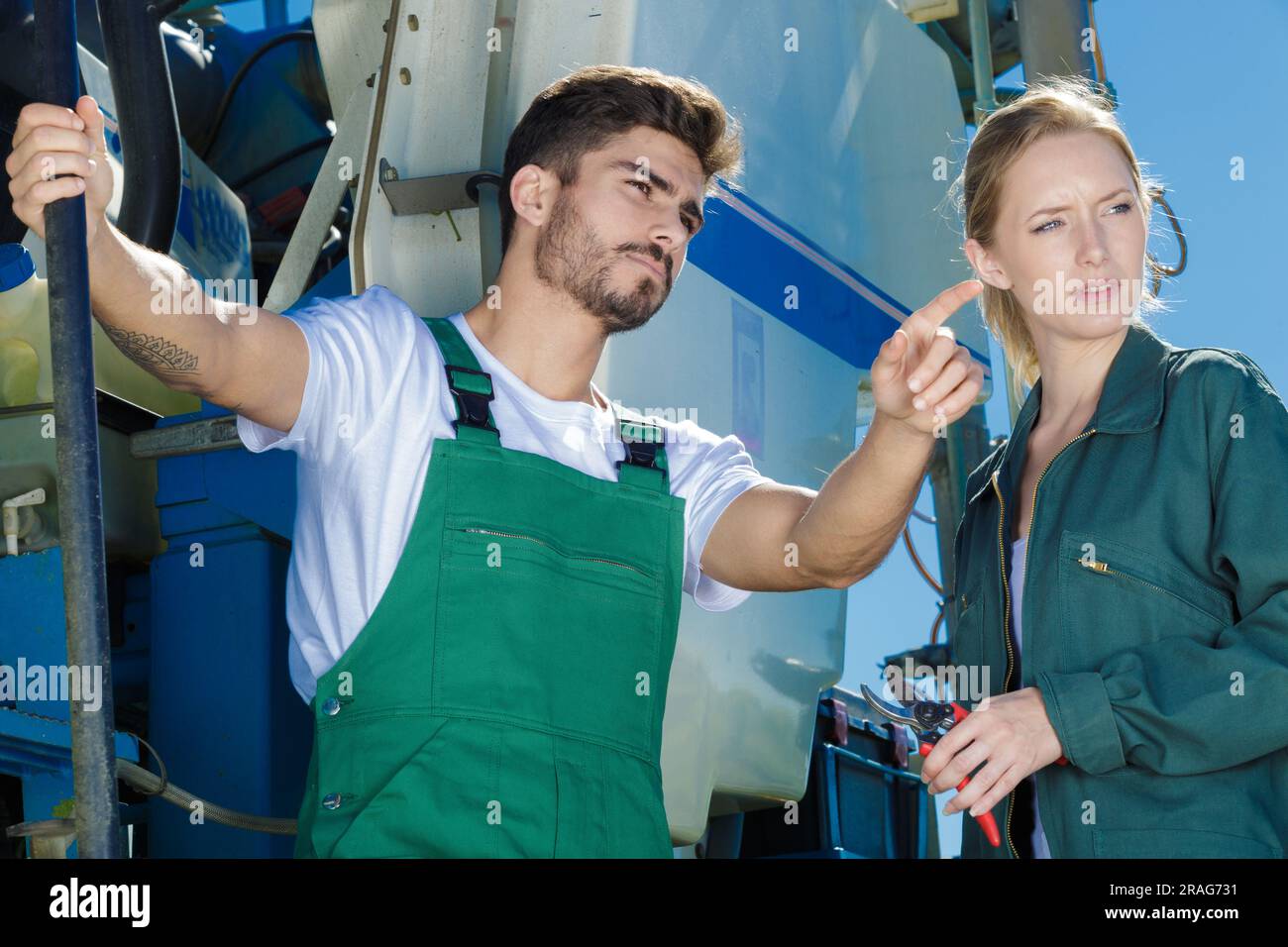Two farm workers hand hi-res stock photography and images - Alamy