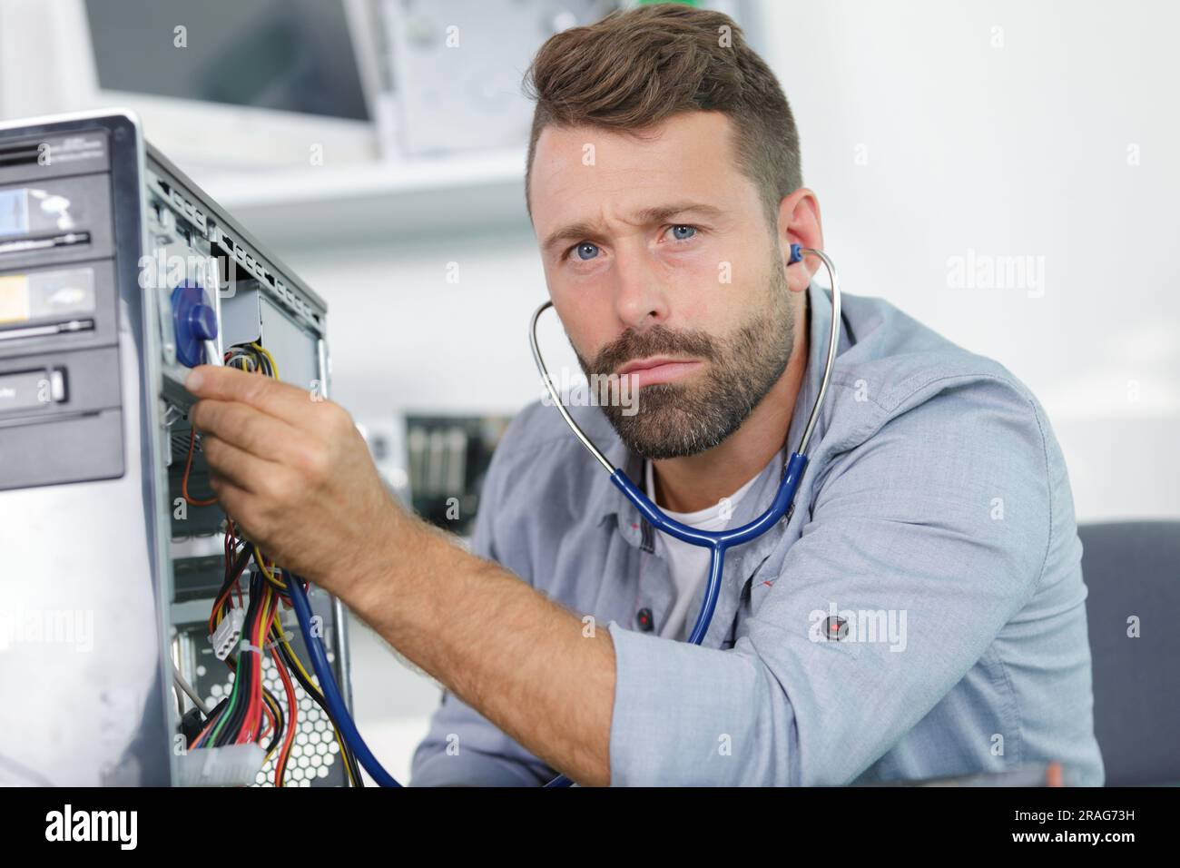 a man assembling laptop computer Stock Photo - Alamy