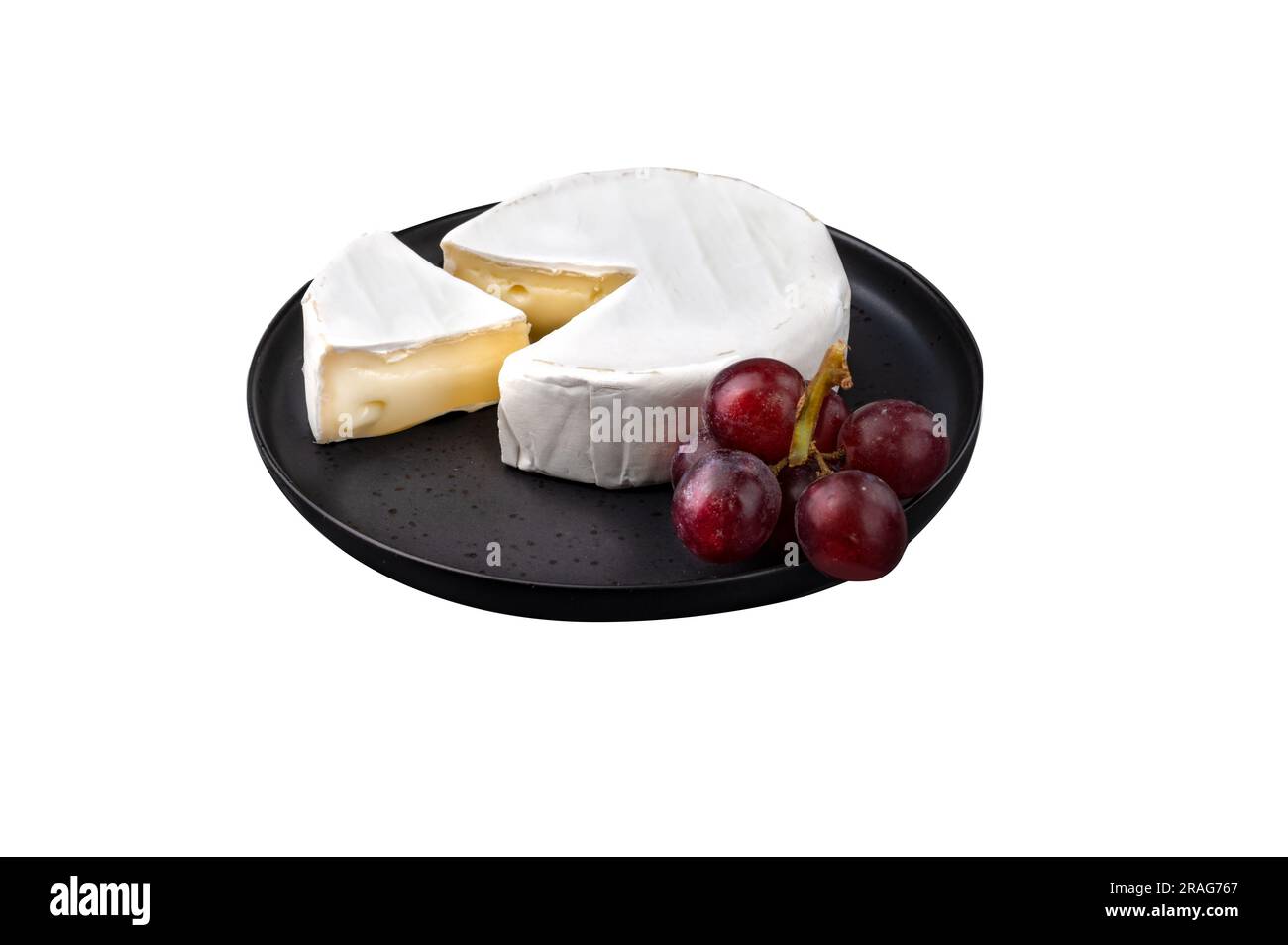 Camembert cheese on plate with fruits on white background Stock Photo ...