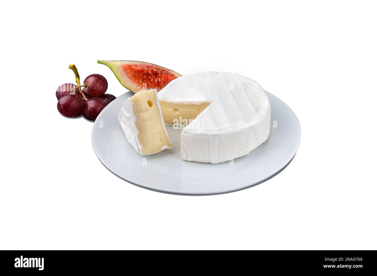 Camembert cheese on plate with fruits on white background Stock Photo ...