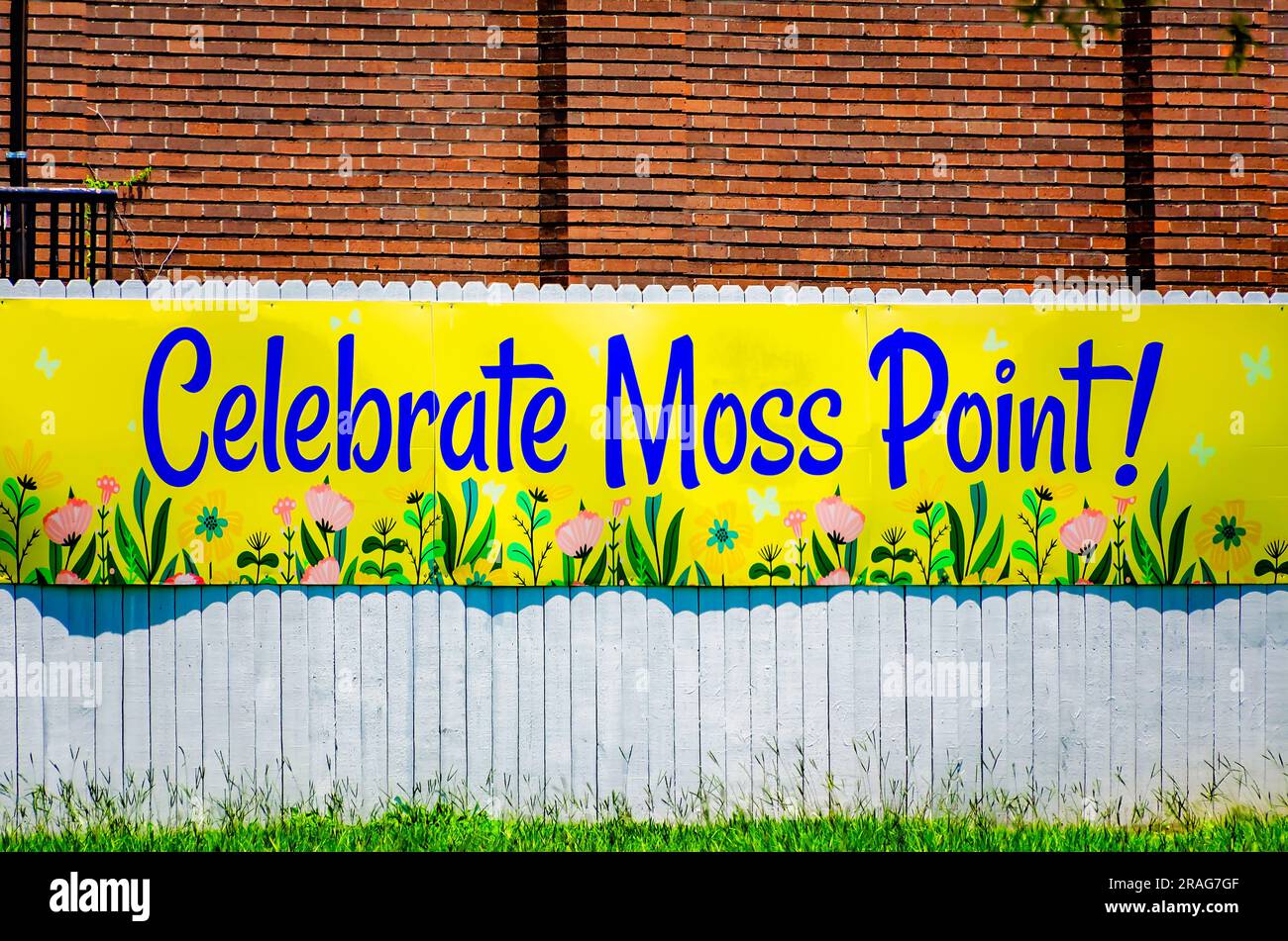 A “Celebrate Moss Point” sign hangs on a fence, June 24, 2023, in Moss ...