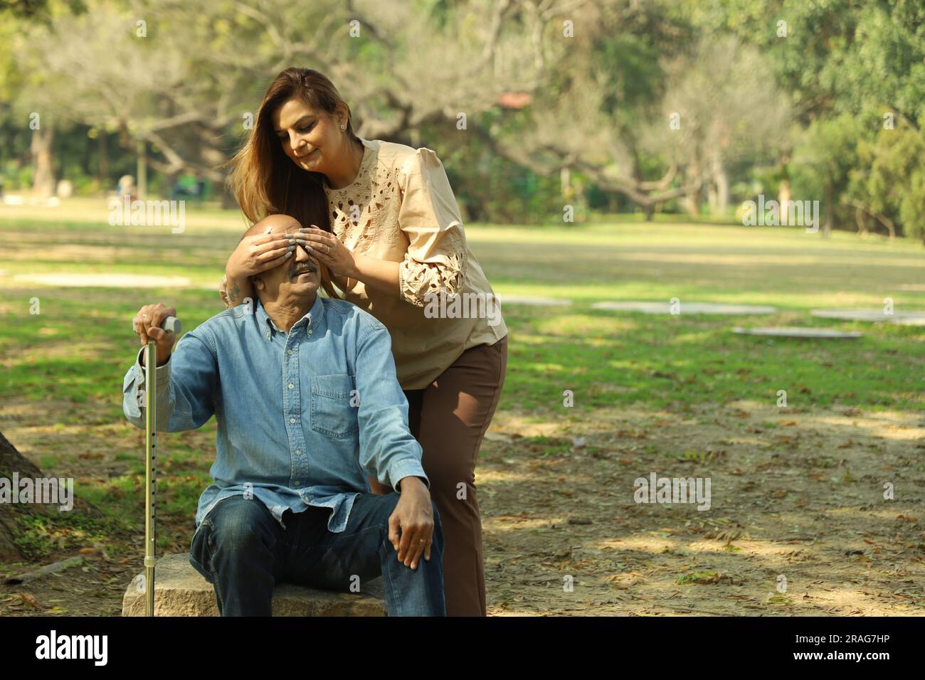 Old Indian romantic couple having a good time together in the city park ...