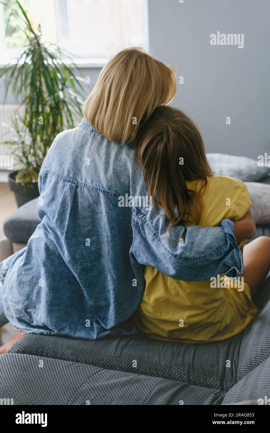 Young loving mother hugging her teenage daughter, mom demonstrating ...