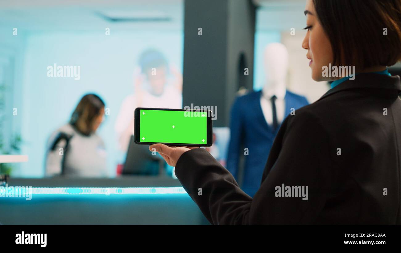 Asian assistant showing isolated greenscreen hi-res stock photography ...