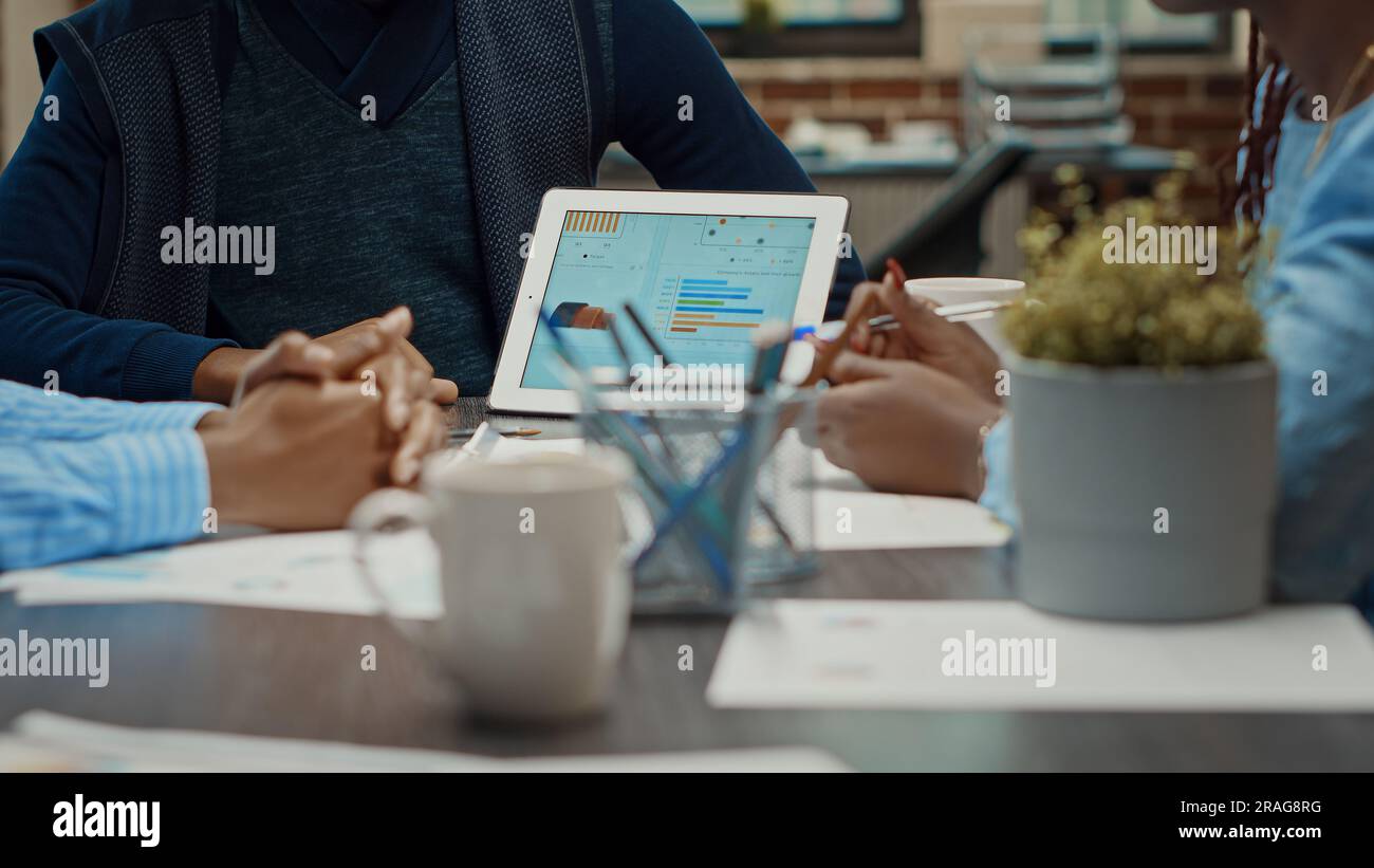 Businessman talking about research data with coworkers, planning new ...