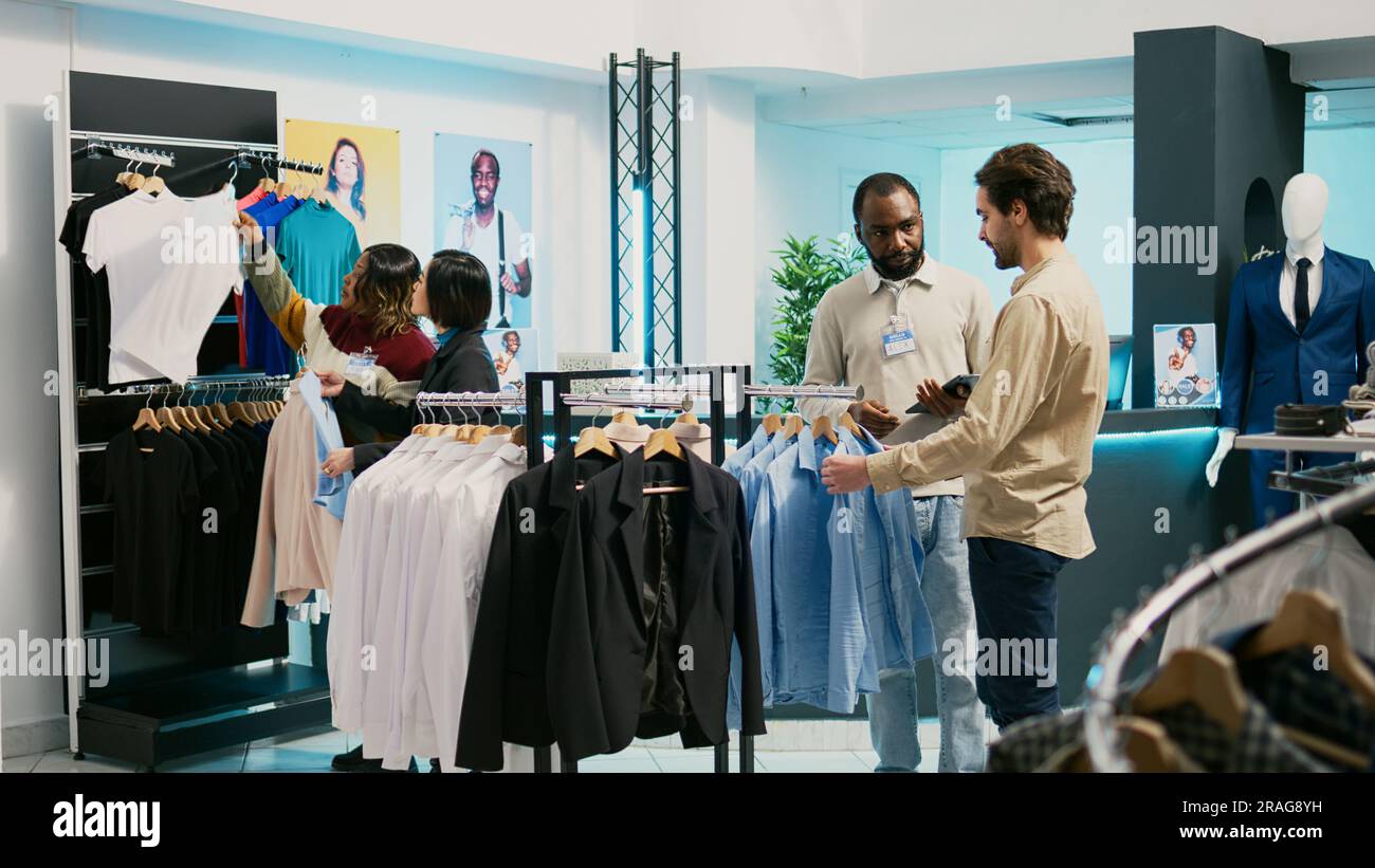 Clothing store employee examining hi-res stock photography and images ...