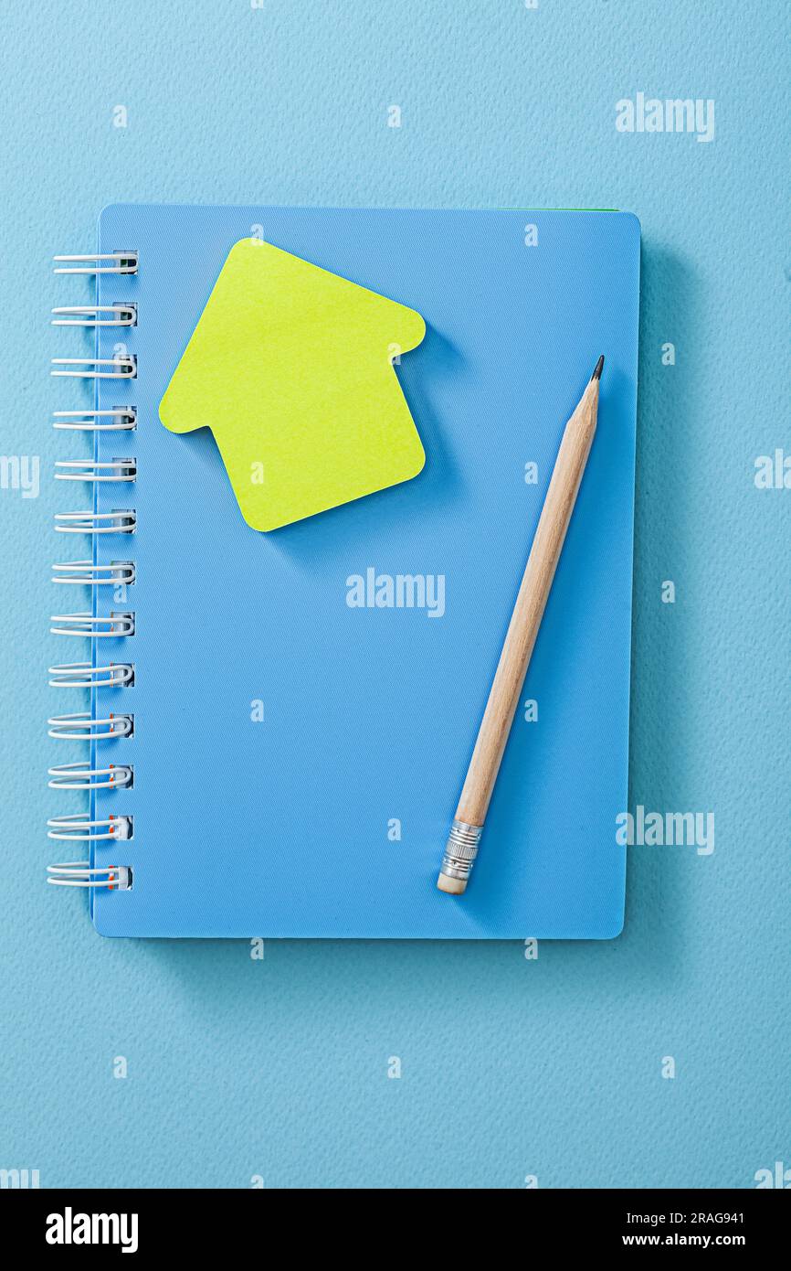 Blue Note Pad Wooden Pencil And Yellow Sticky Note Stock Photo - Alamy