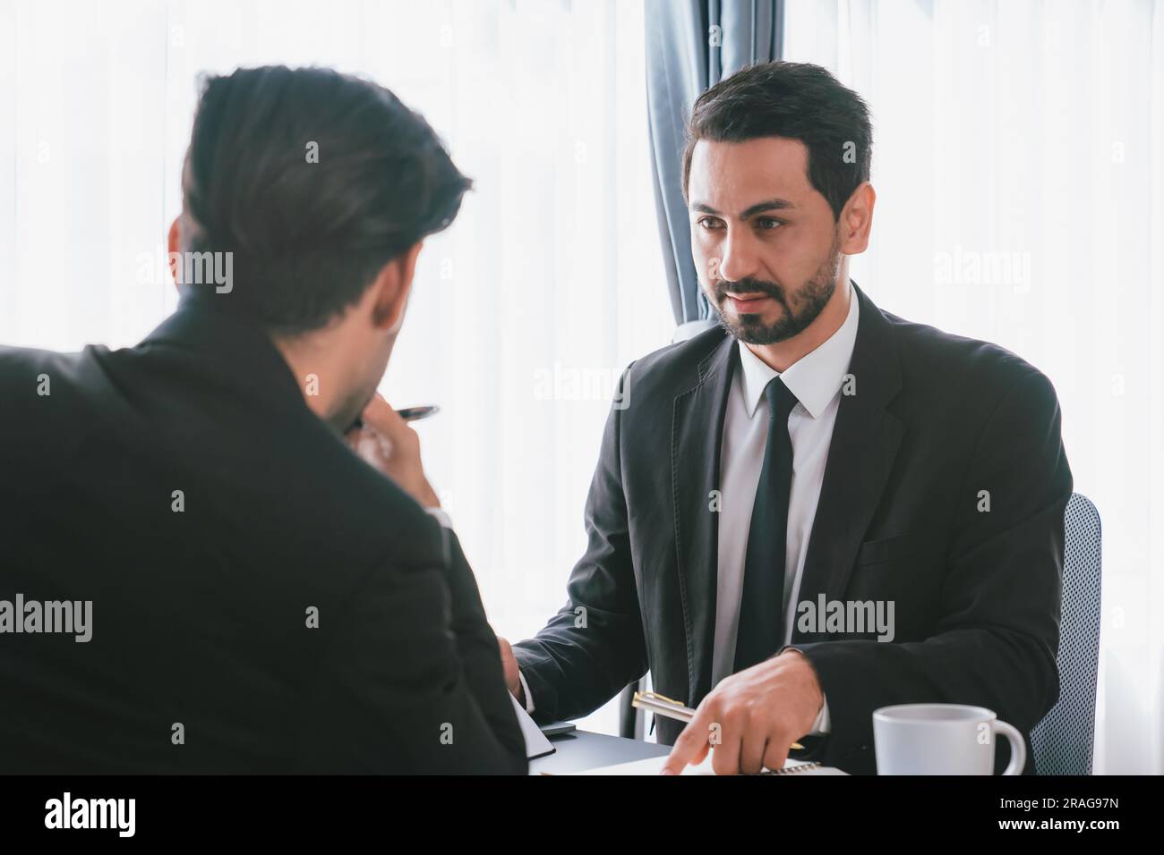 Busy analyst team discussing financial data on digital dashboard ...