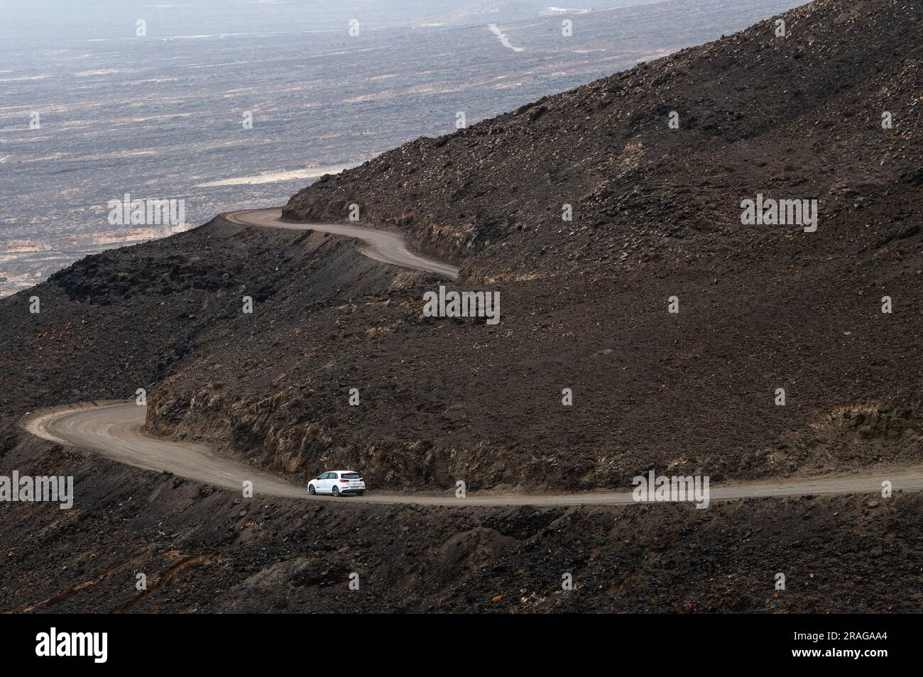 A car heading though a dirt road to Cofete Beach, south of ...