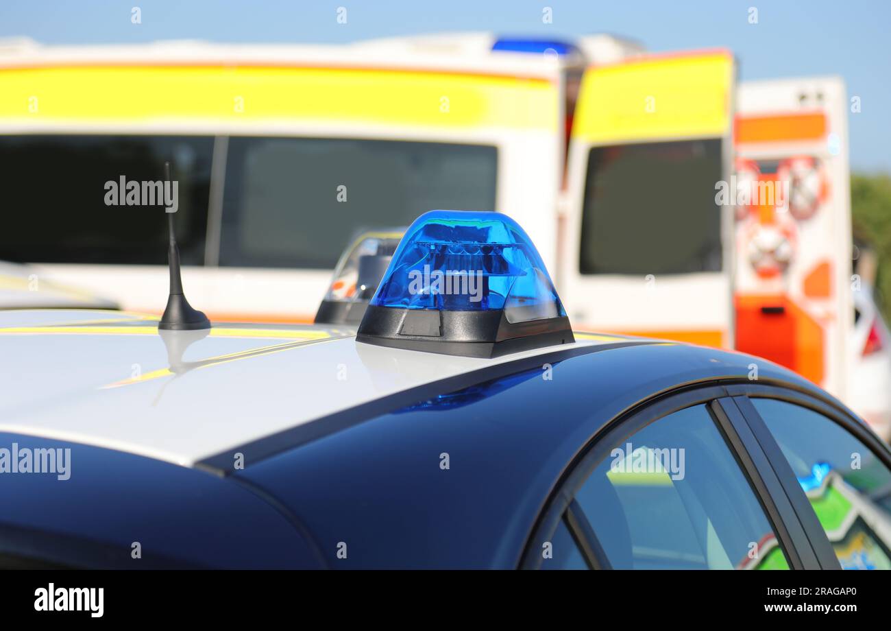 blue flashing light of the police car with the background of an ...