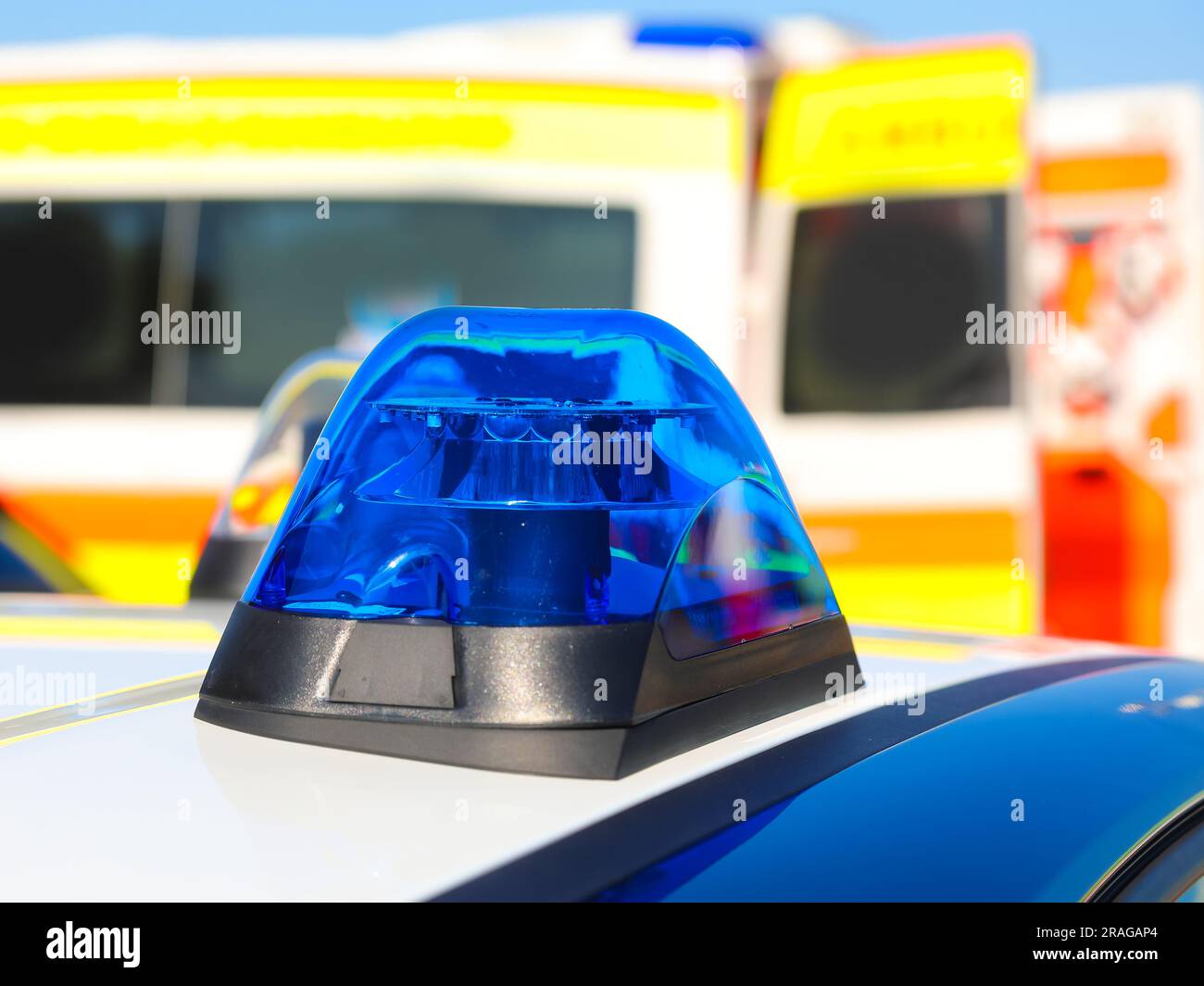 blue flashing light of the police car with the background of an ...