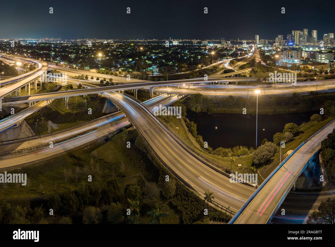 Aerial view of american highway junction at night with fast driving ...