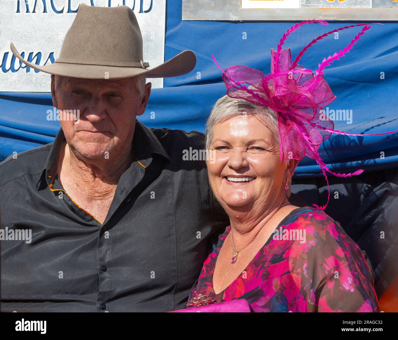 Mature Caucasian couple posing on Ladies' Day at the ABC Bush Races ...