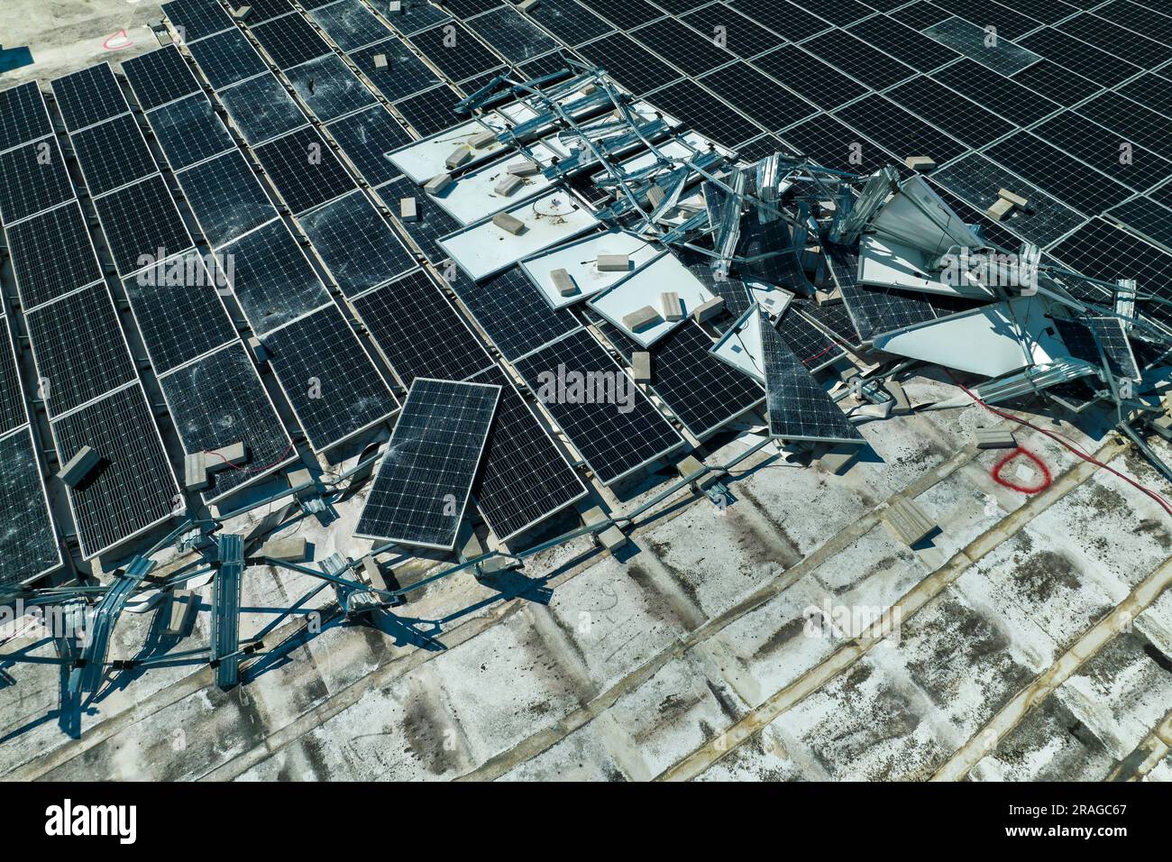 Aerial view of damaged by hurricane wind photovoltaic solar panels ...