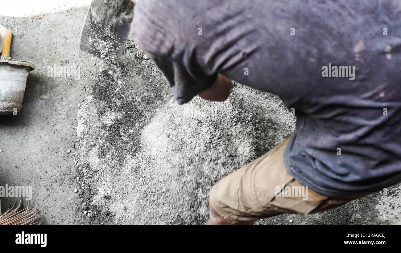 Hoe mixing cement sand hi-res stock photography and images - Alamy