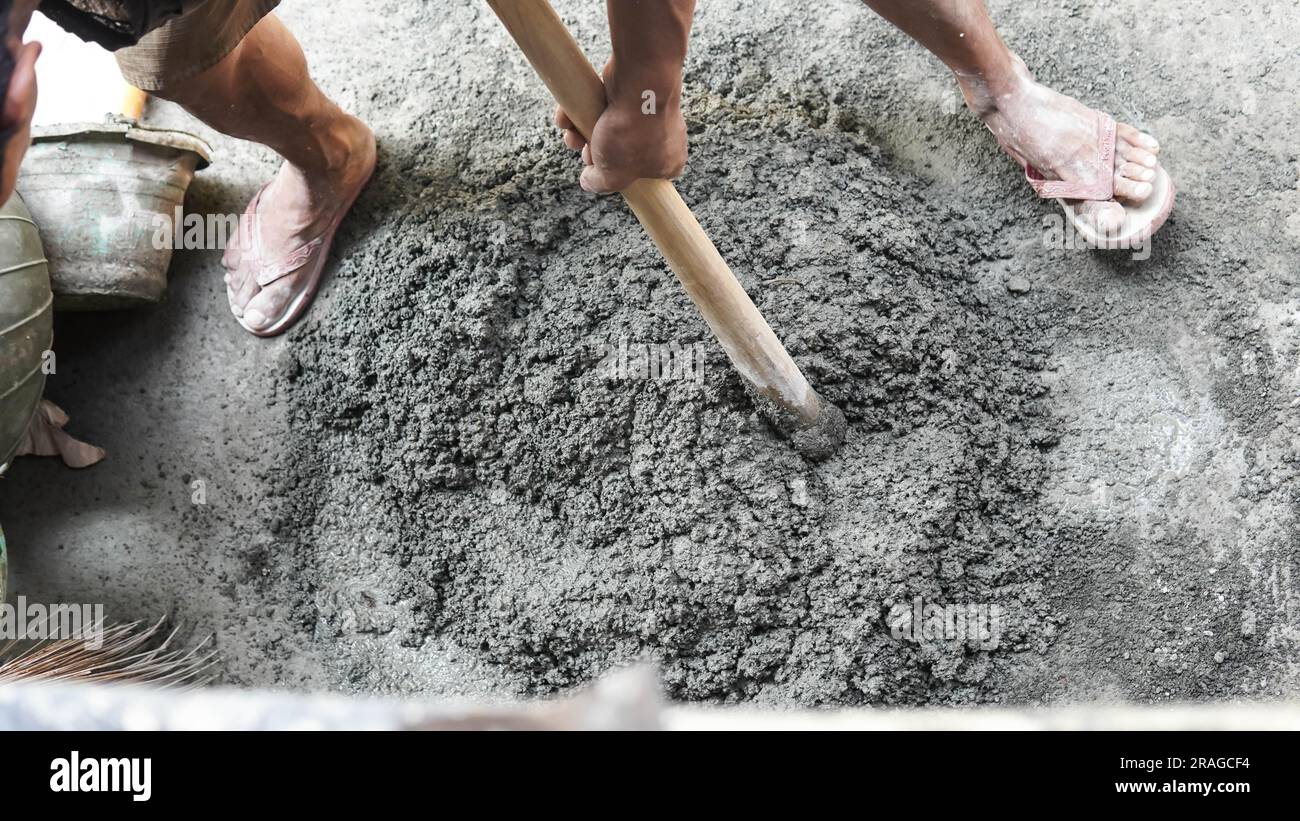 Hoe mixing cement sand hi-res stock photography and images - Alamy